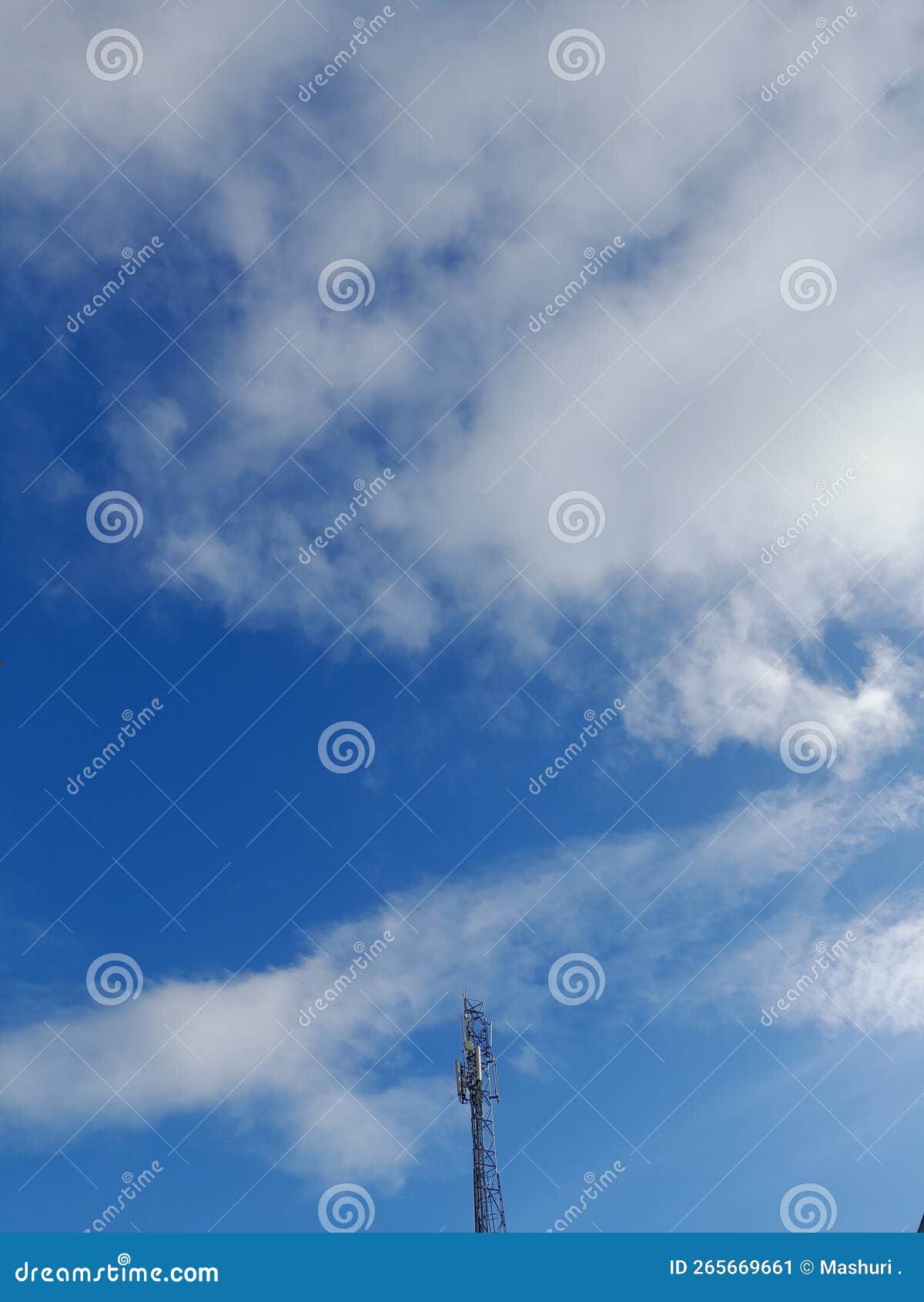 Transmitter Tower with a Background of Blue Sky and Clouds Stock Image ...