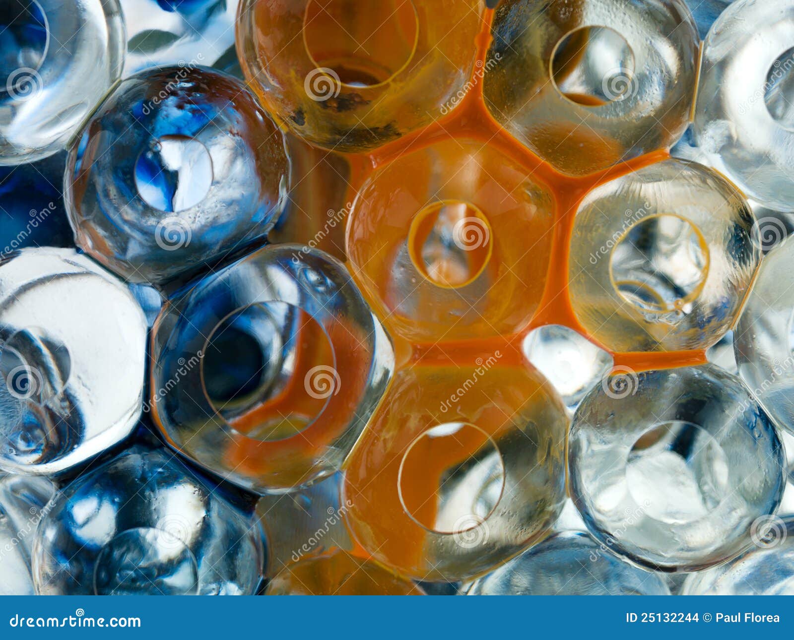 Transparent Balls with Orange Pigment and Blue Ink Stock Photo - Image ...
