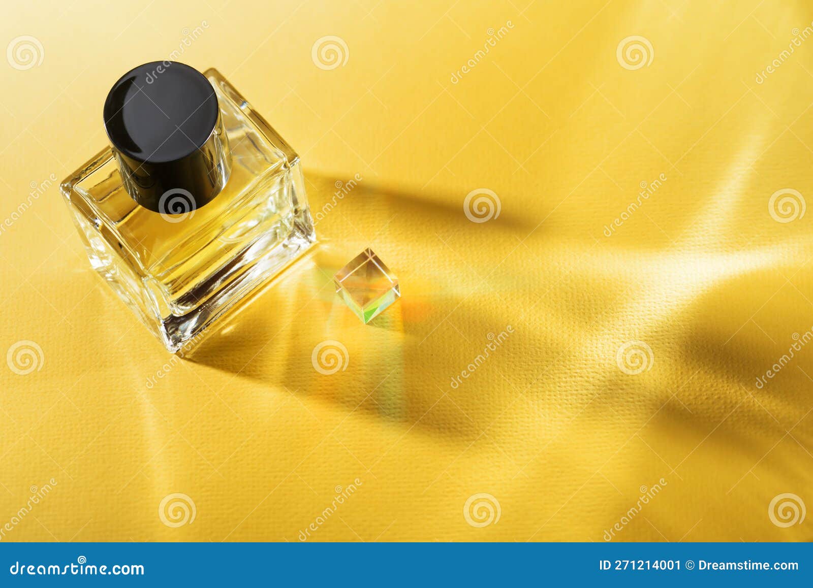 Transparent Bottle of Perfume on a Yellow Background with Sun Light ...