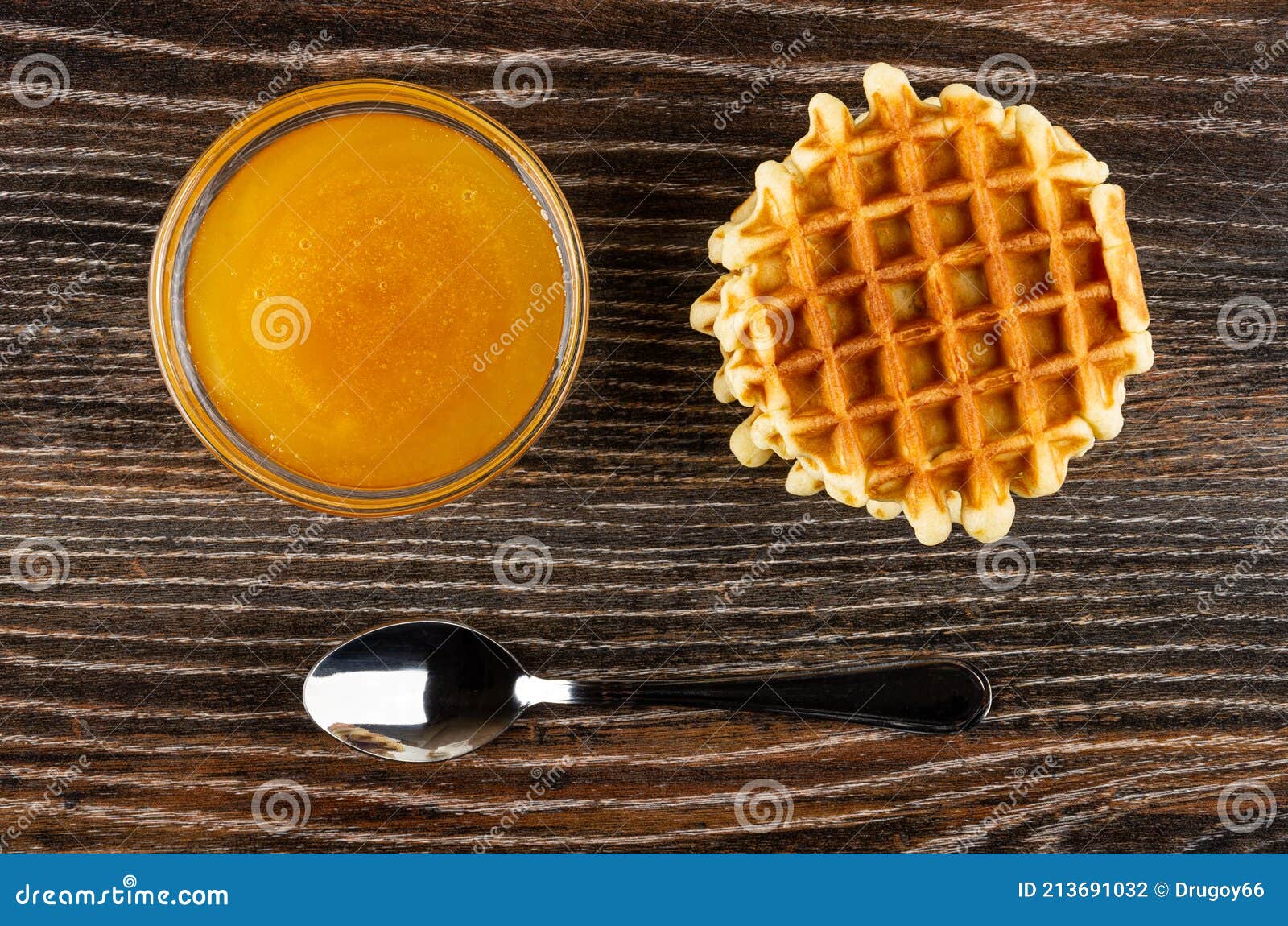 Bowl with Honey, Stack of Biscuit Waffles, Spoon on Wooden Table. Top ...