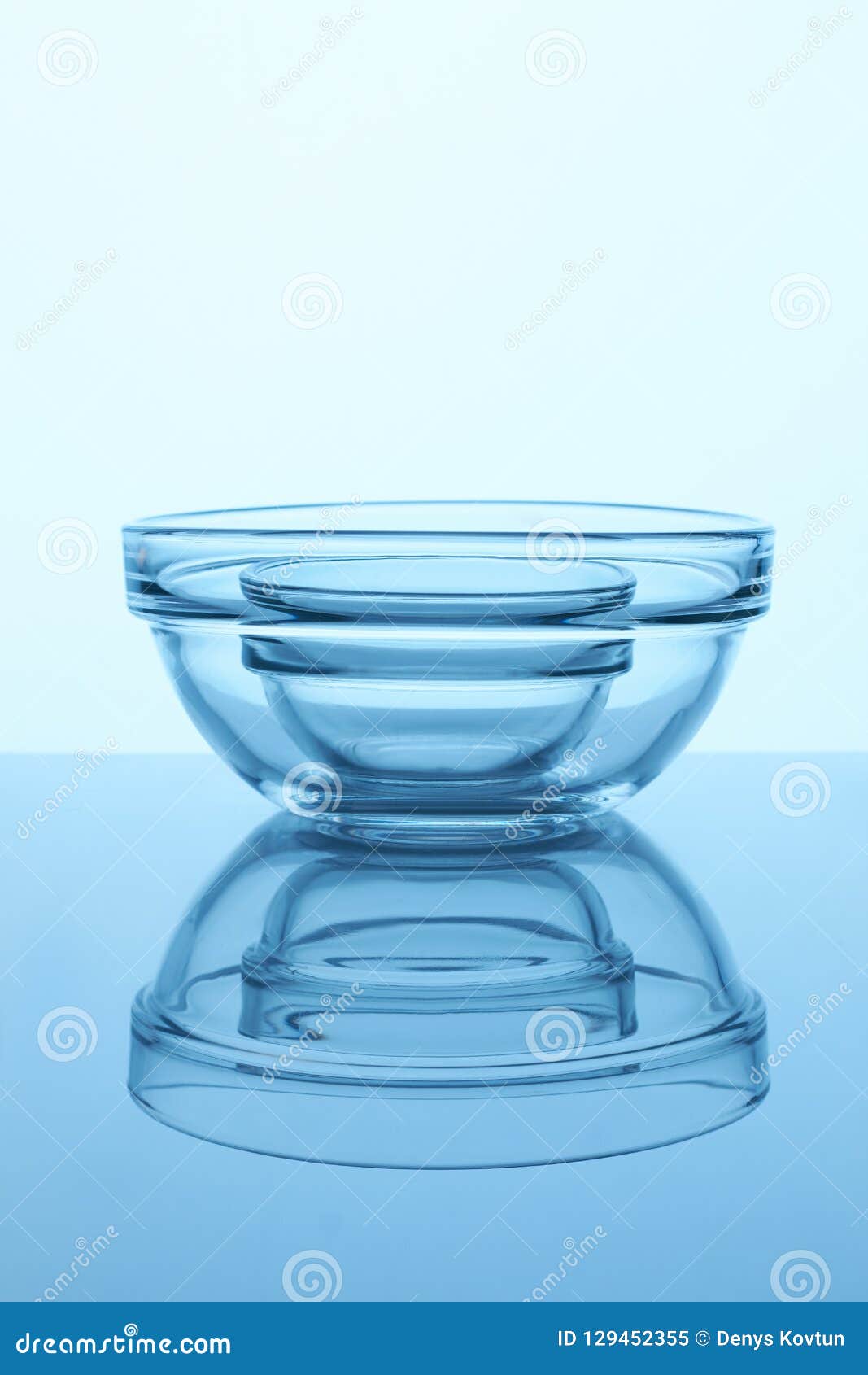 Transparent Bowls on Reflective Surface. Stock Image - Image of crystal ...