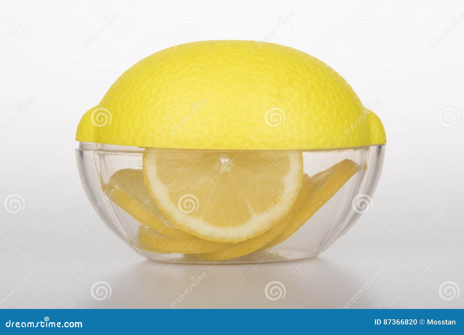Transparent Container for Lemon and a Sliced Lemon Inside Stock Photo ...