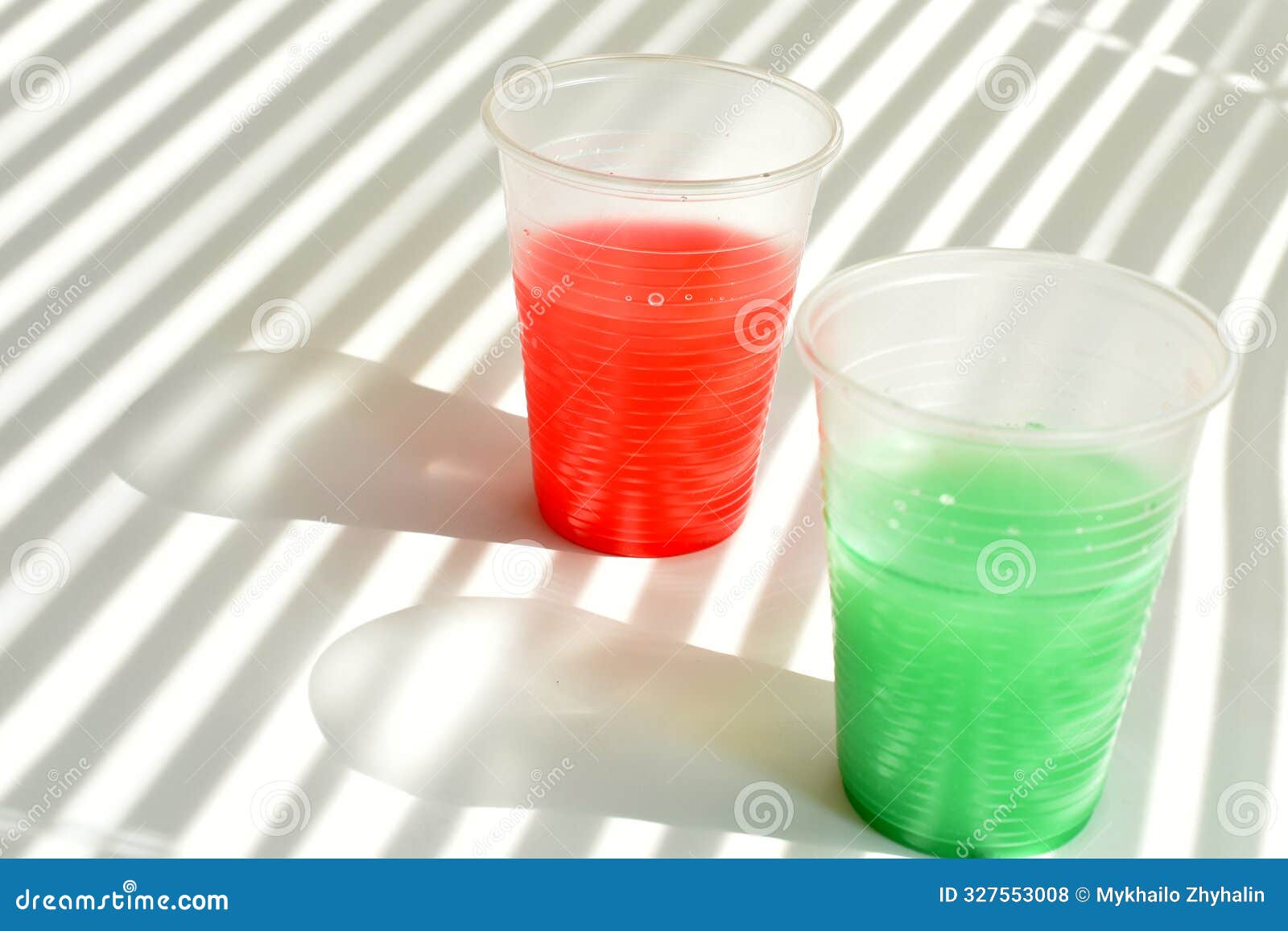Transparent Cups and Shadow on the Table Surface. Stock Photo - Image ...