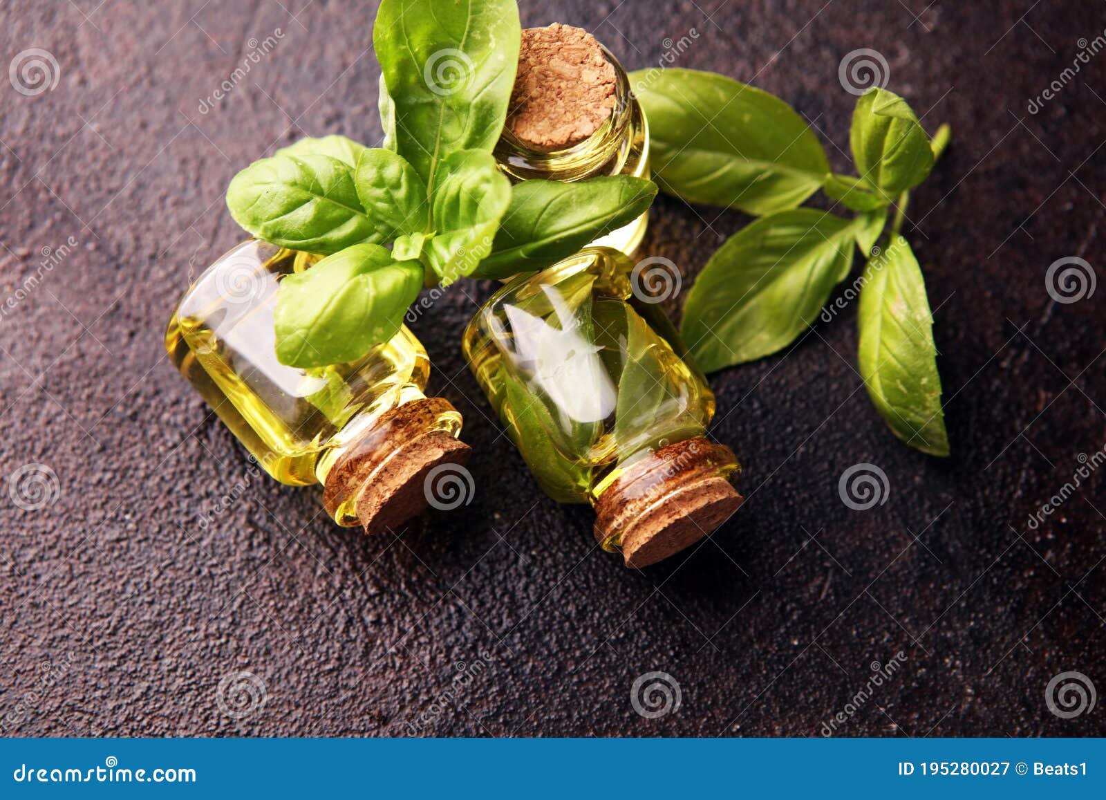 A Transparent Glass Bottle of Basil Essential Oil with Fresh Basil ...