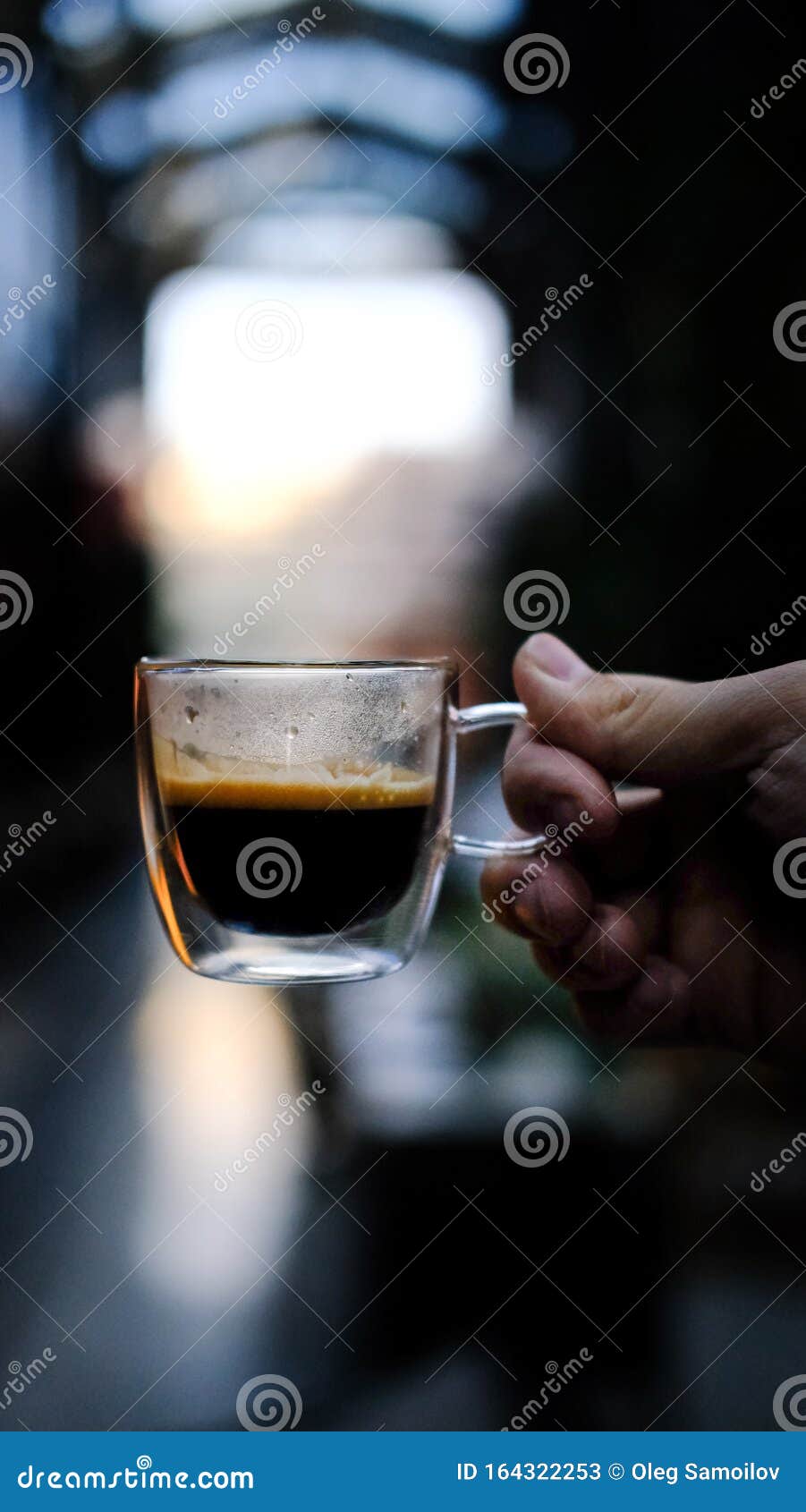 Transparent Glass Cup of Coffee in the Hand. Coffee in a Cafe Stock ...