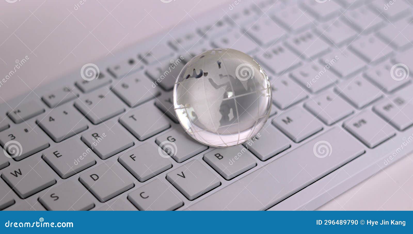 A Transparent Glass Globe on the Keyboard. Stock Photo - Image of globe ...
