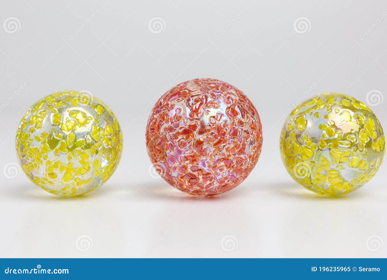 Transparent glass marbles stock image. Image of yellow - 196235965