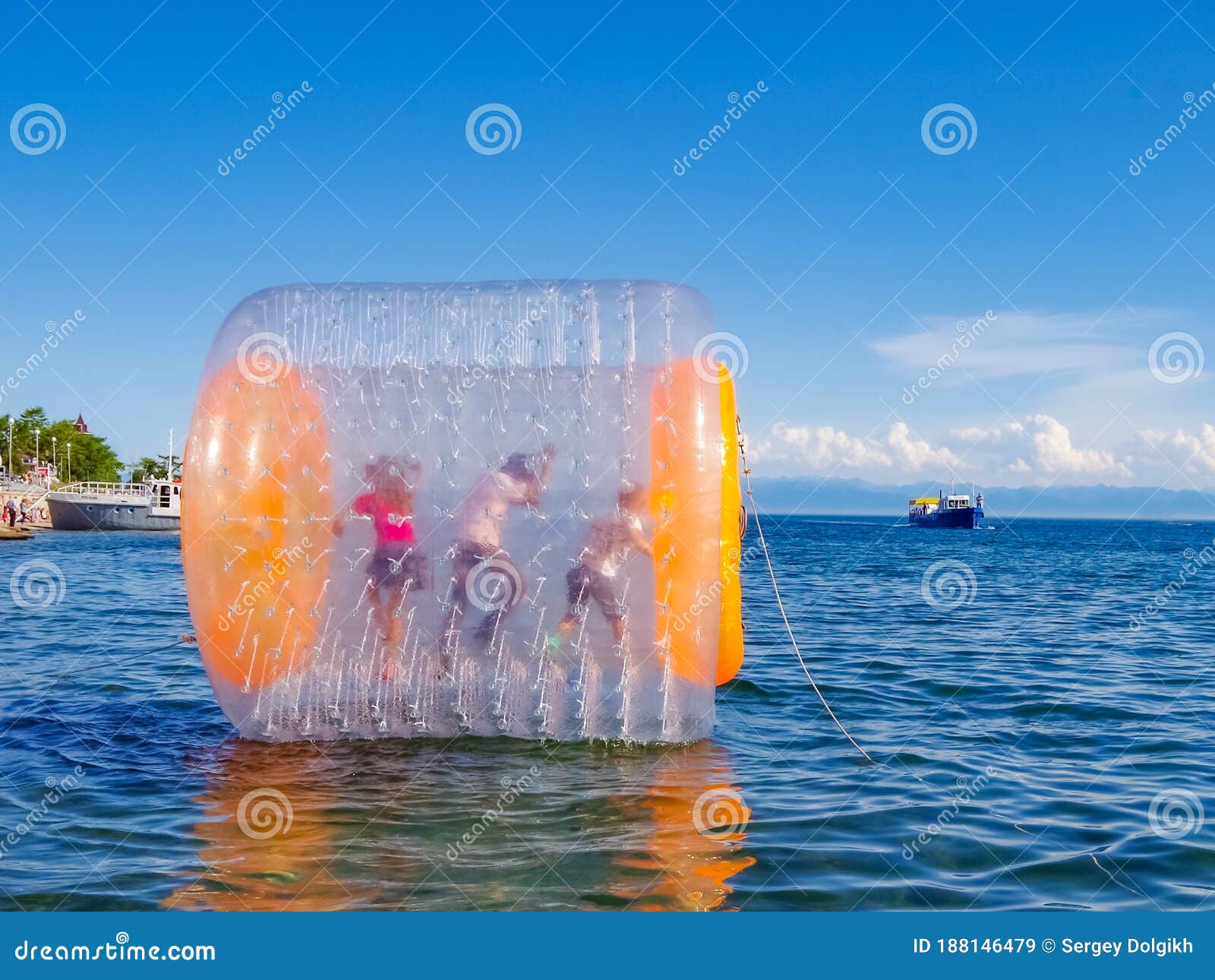 Transparent Inflatable Water Attraction with Playing Children Stock ...