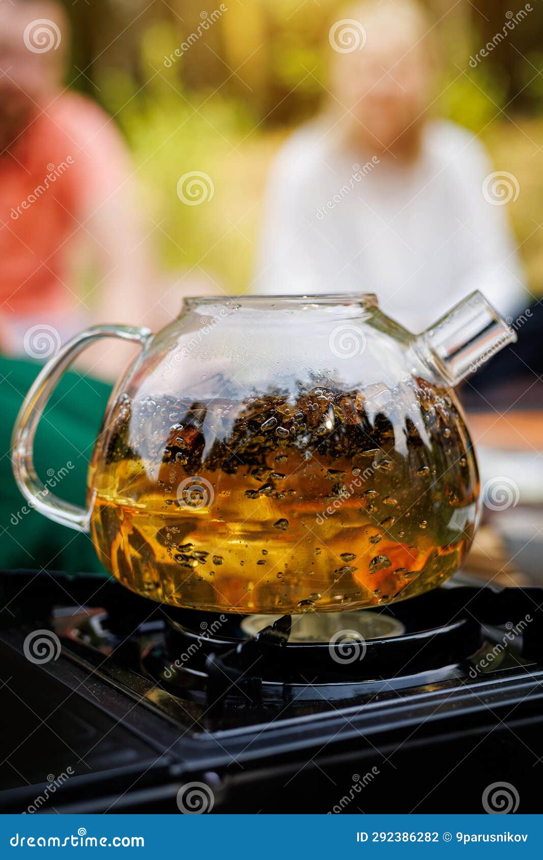 A Transparent Kettle is Heated on an Electric Stove. the Tea is Boiling ...