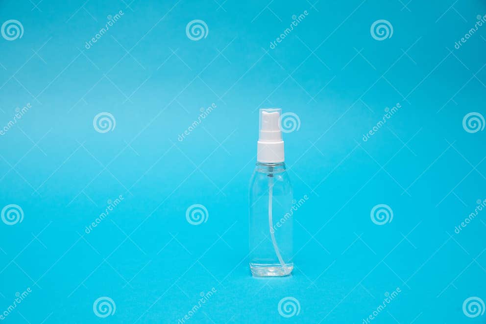 Transparent Mist Spray Bottle on a Blue Background Stock Photo - Image ...