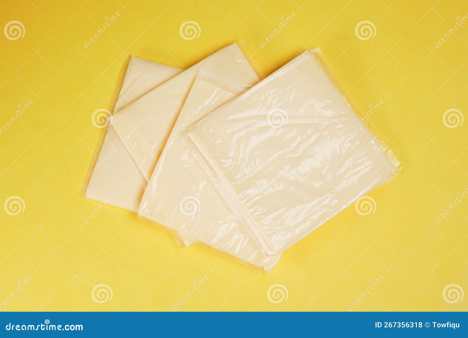 Transparent Packet with Slices of Cheese on Yellow , Stock Photo ...