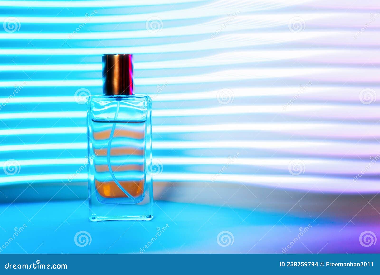Transparent Perfume Rectangular Bottle on Striped Blue Background, Neon ...