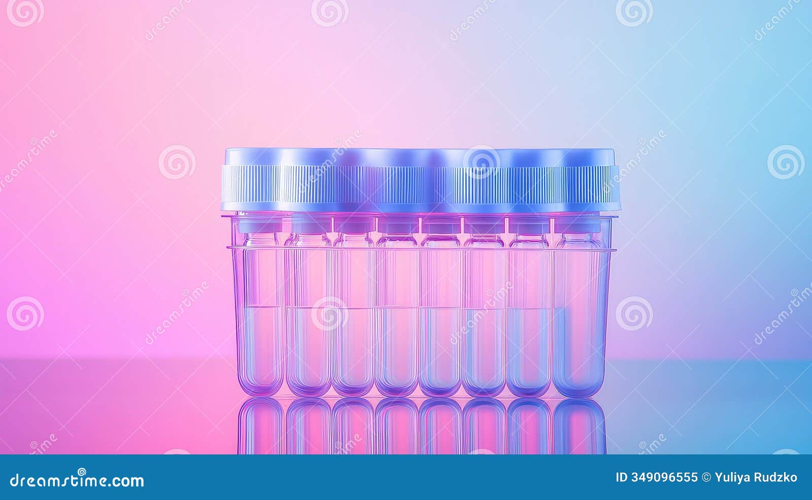 Transparent Plastic Container with Small Vials on Reflective Surface ...