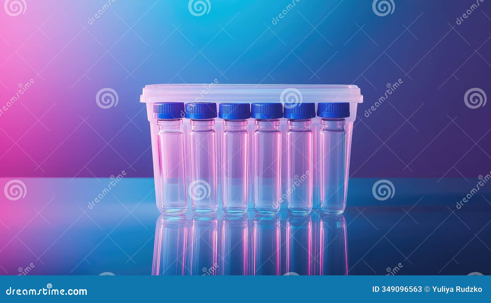 Transparent Plastic Container with Small Vials on Reflective Surface ...