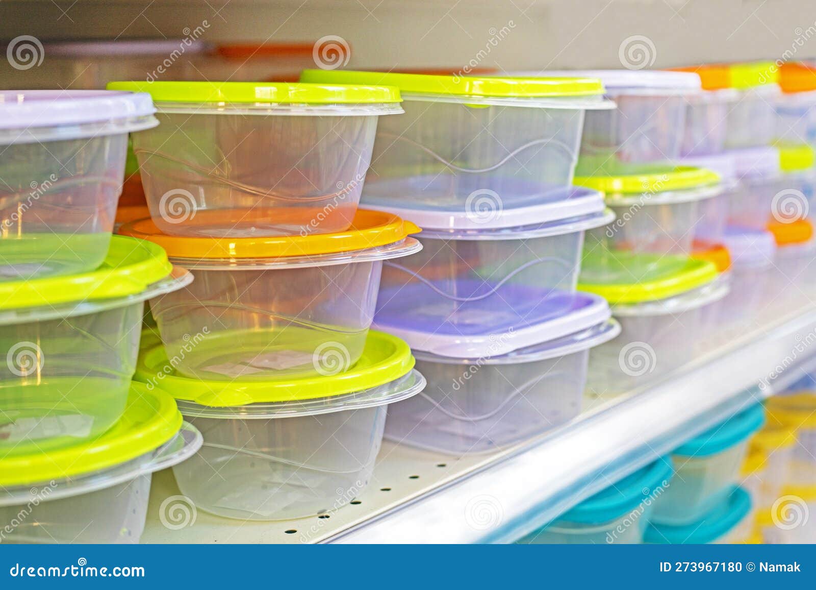 Transparent Plastic Containers with Colorful Lids on the Store Counter ...