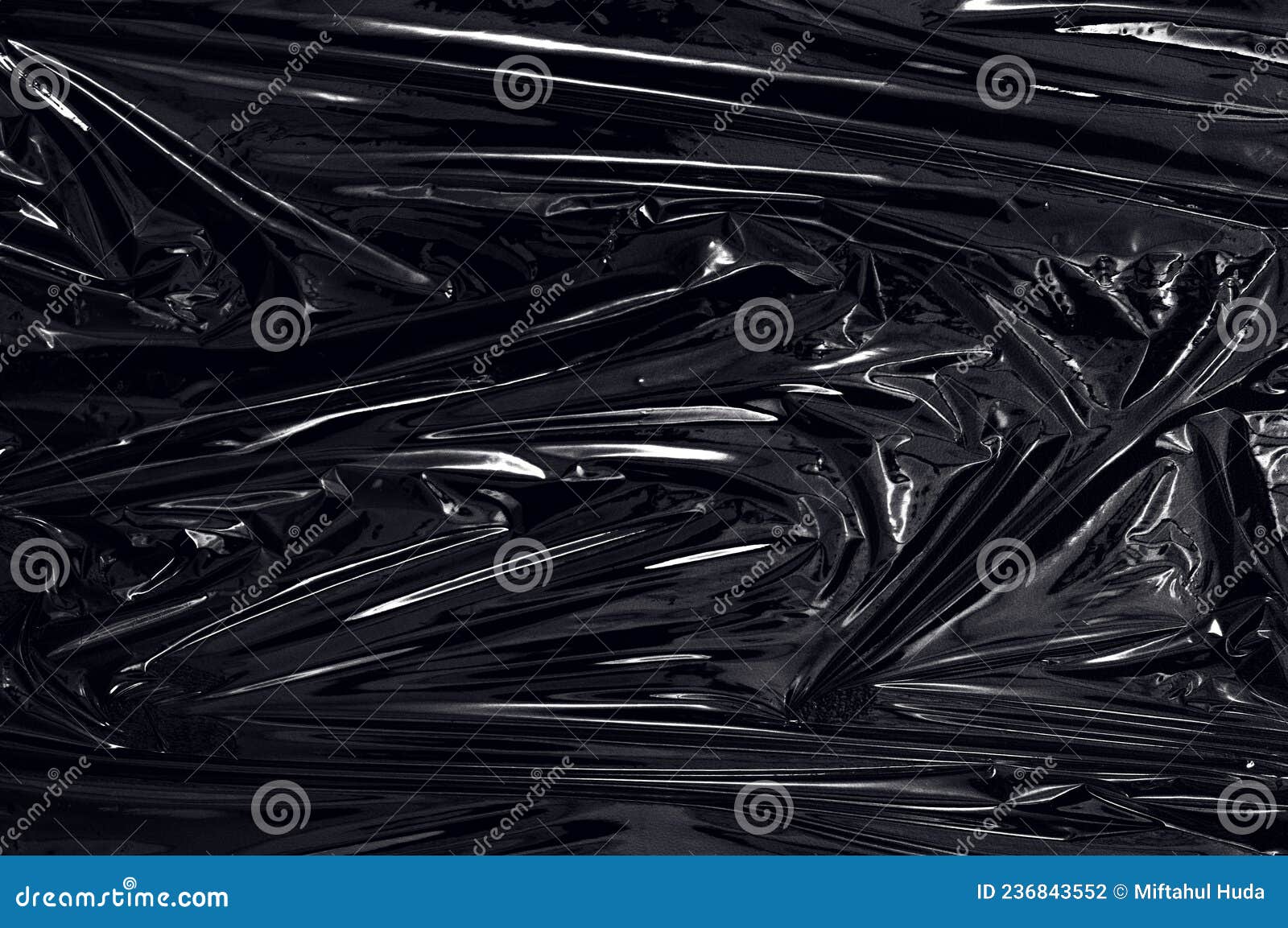 A Transparent Plastic Wrap with a Hole on Black Background. Stock Photo ...