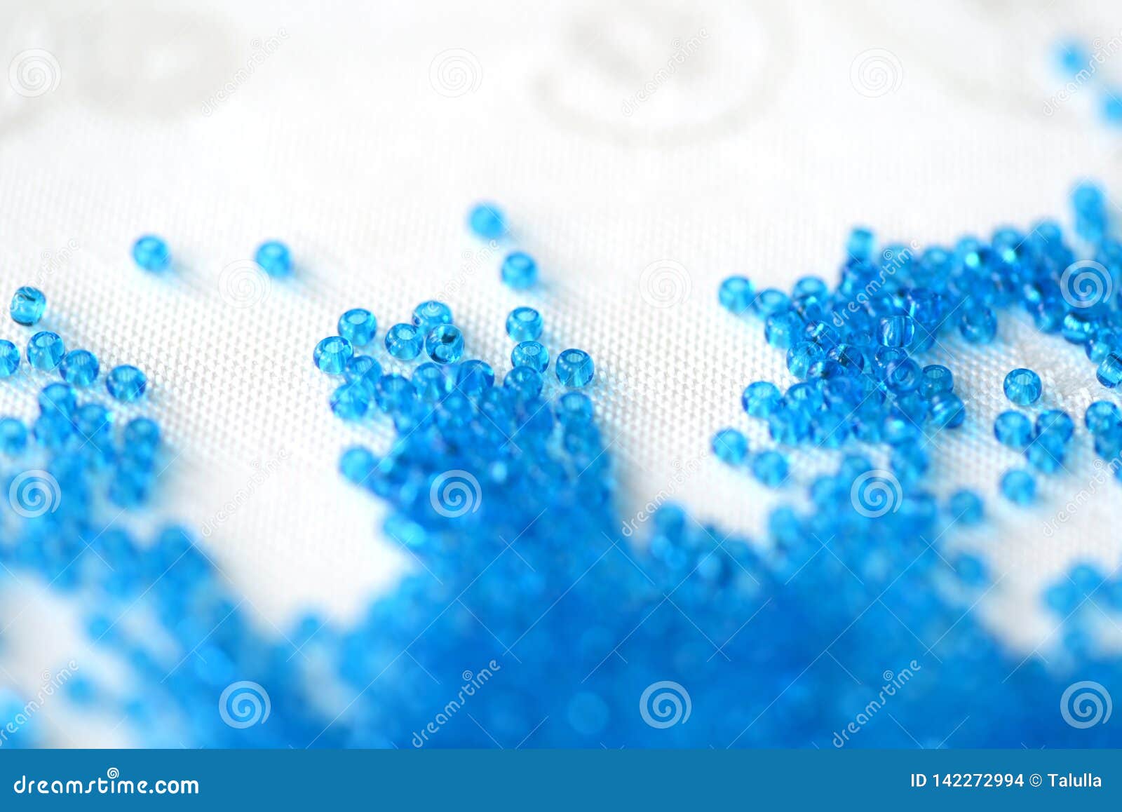 Transparent Seed Beads Blue Color Scattered on a Textile Background ...