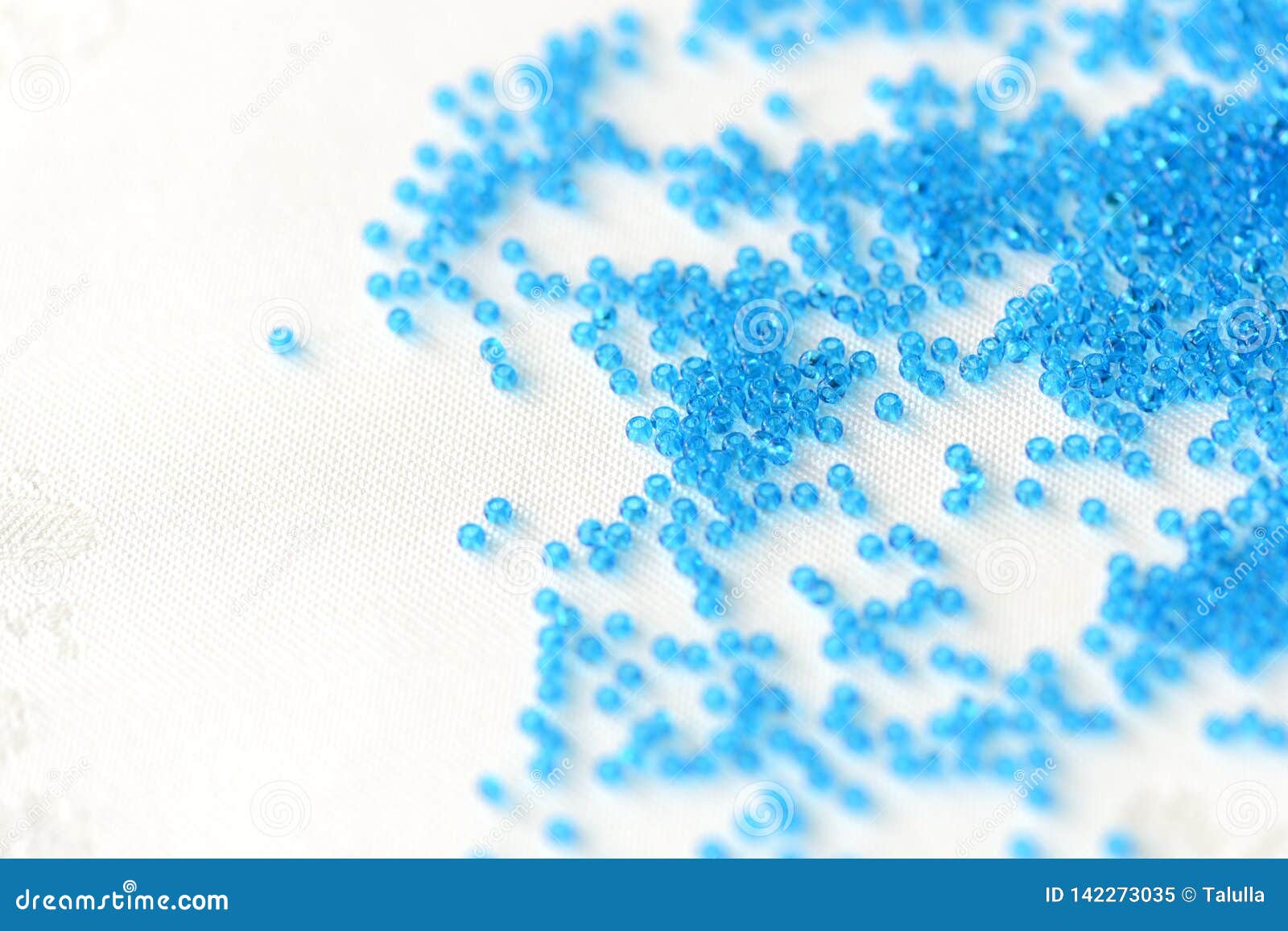 Transparent Seed Beads Blue Color Scattered on a Textile Background ...