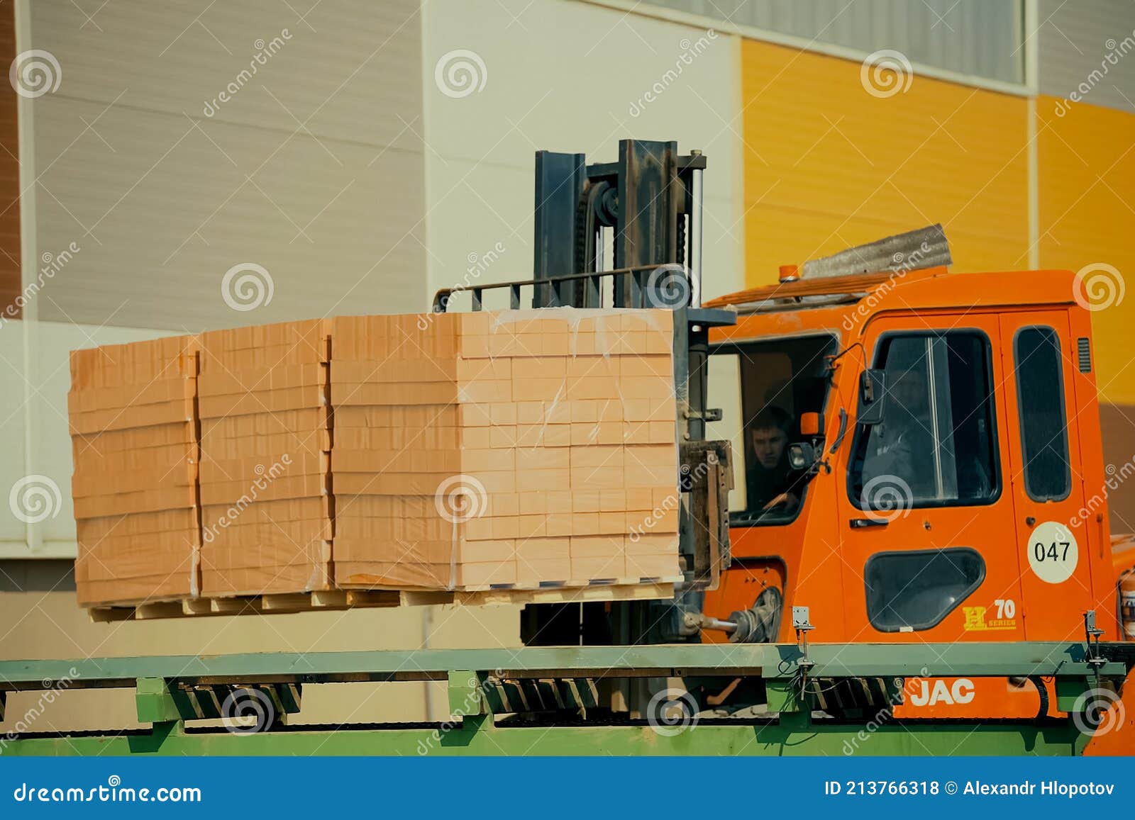 Transportation Of Pallets With A Brick Using A Loader Editorial Image ...