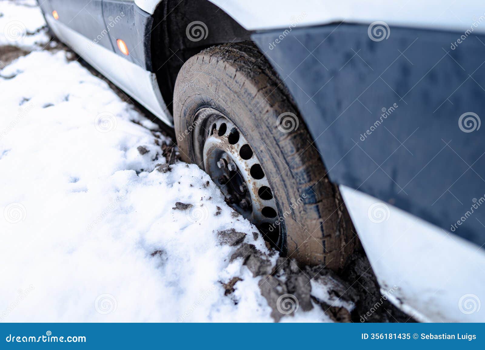 A Transporter Car is Stuck in the Snow and Getting Pulled Out with a ...