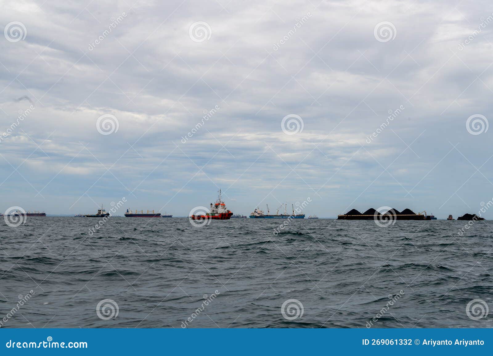 Transporting Coal into Large Ships in the Middle of the Sea Stock Photo ...