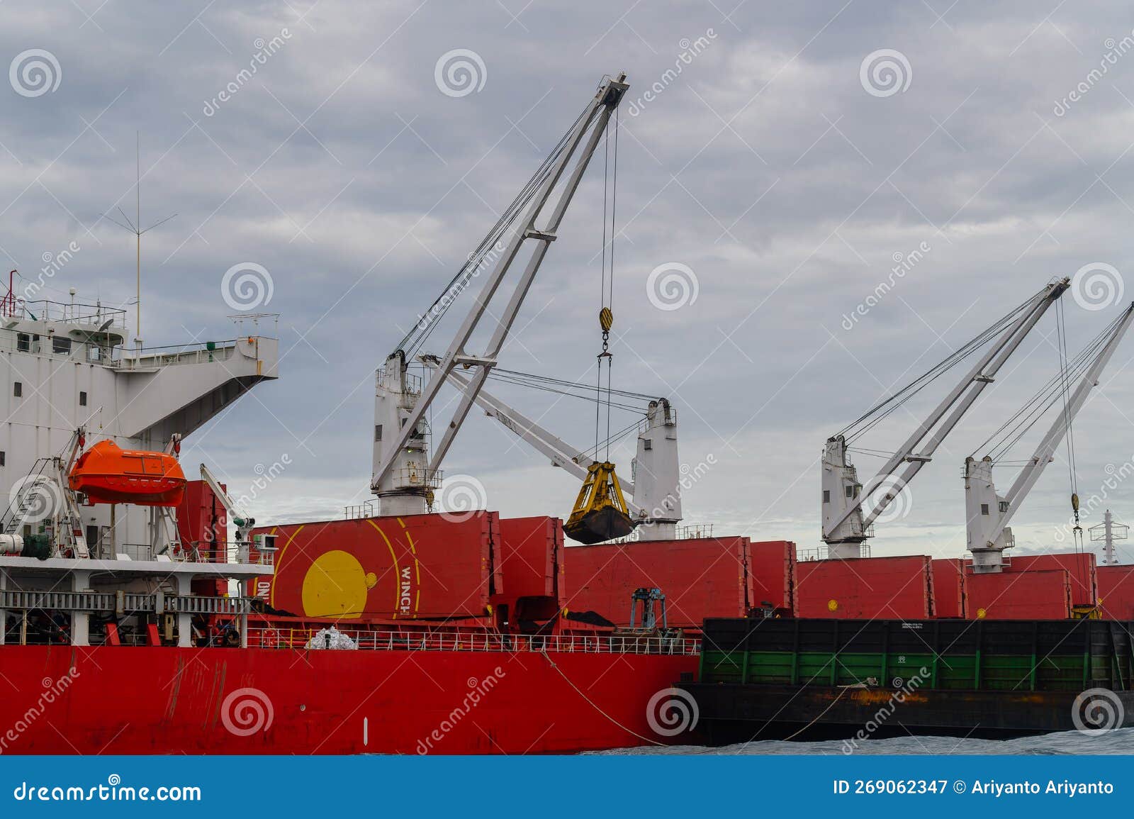 Transporting Coal into Large Ships in the Middle of the Sea Stock Image ...