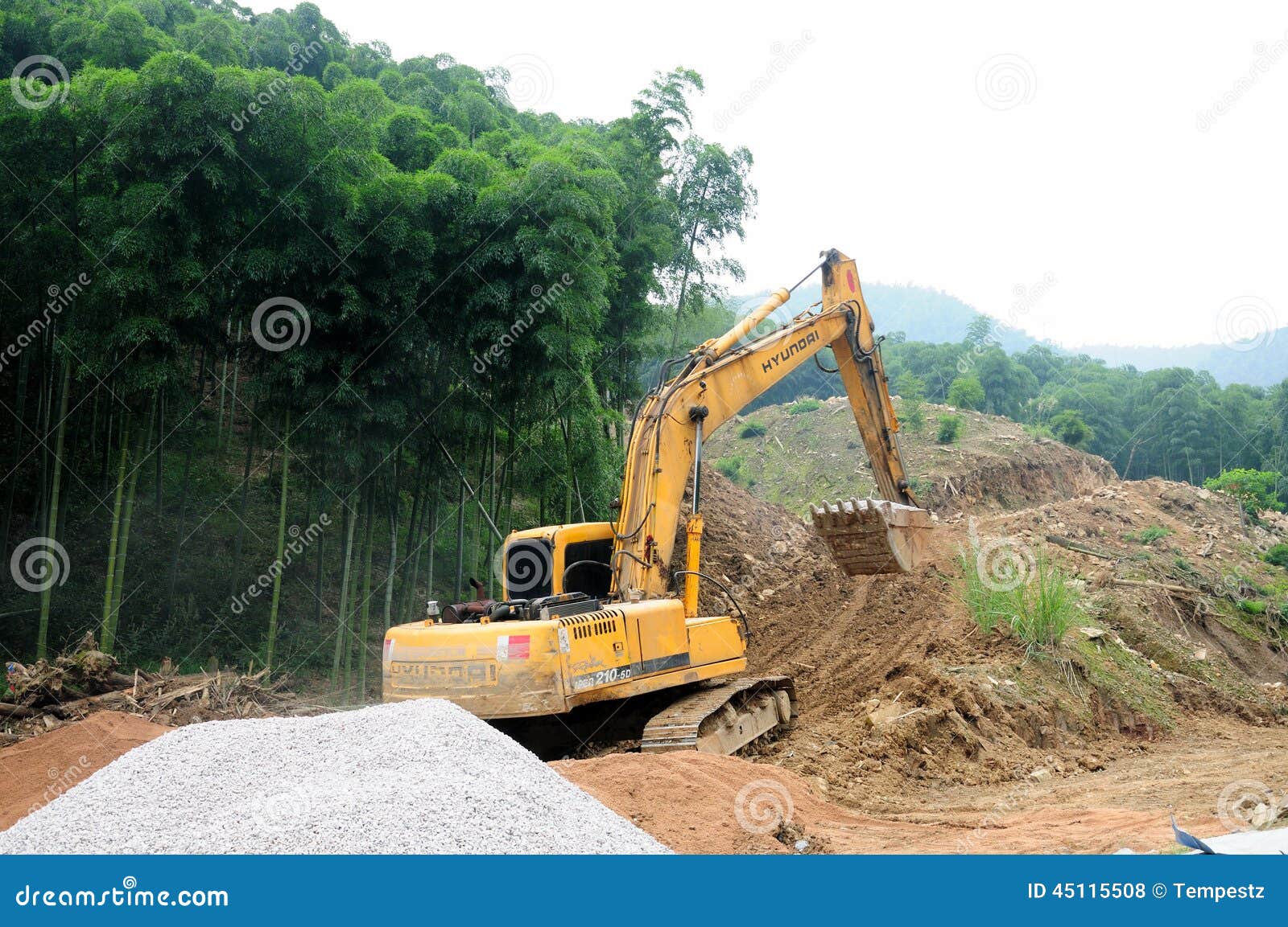Transporting Rocks in a Back Hoe Editorial Stock Photo - Image of ...