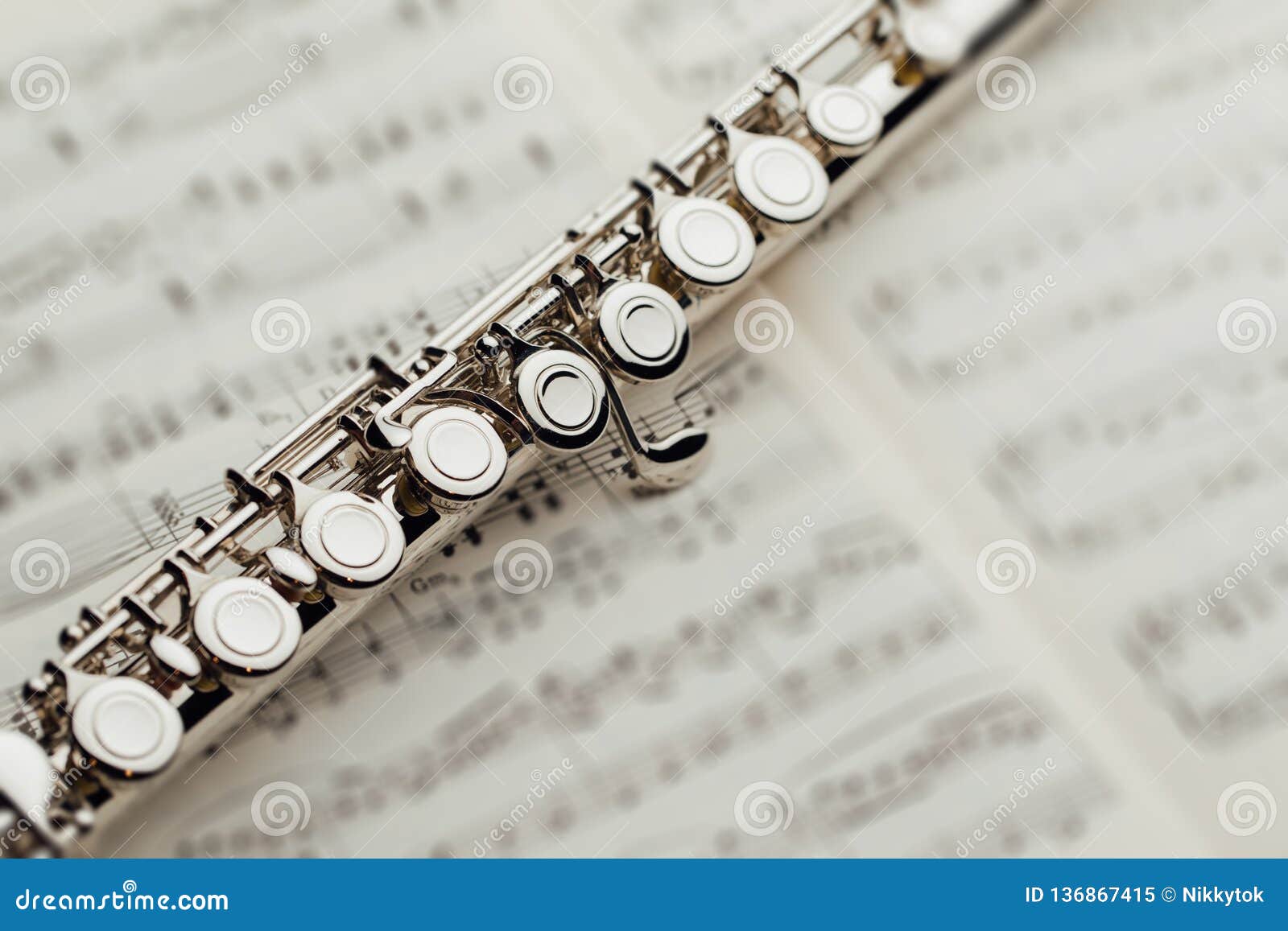 Transverse Flute on Music Sheet Stock Image - Image of classic, chrome ...