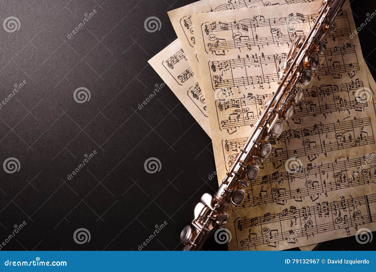 Transverse Flute and Old Sheet Music on Black Table Top View Stock ...
