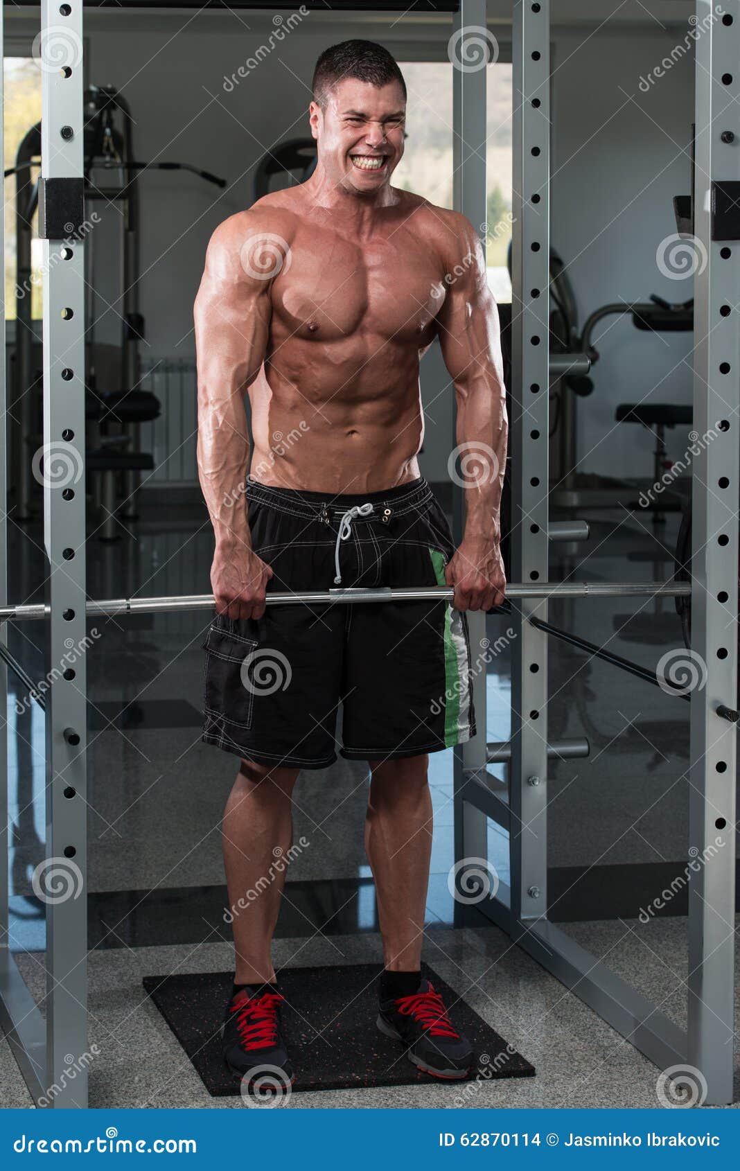 Trapezius Exercising with Barbell Stock Photo - Image of muscles ...