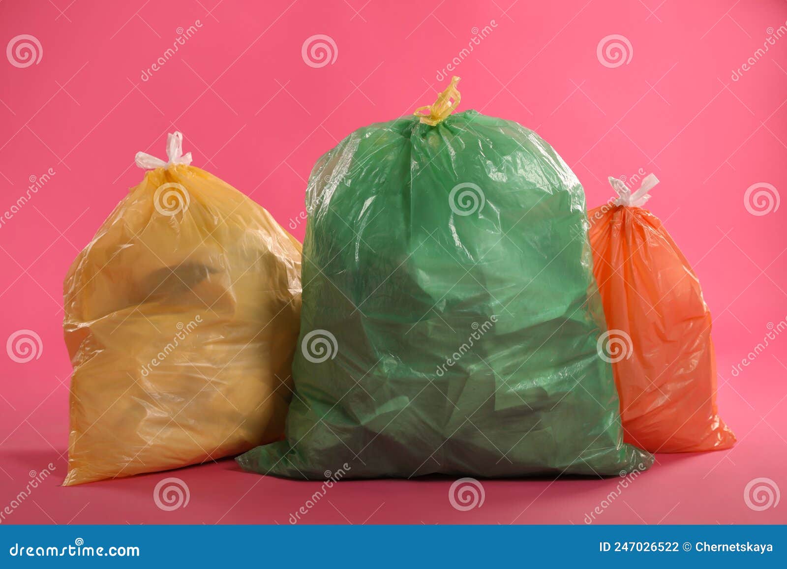 Trash Bags Full of Garbage on Pink Background Stock Photo - Image of ...
