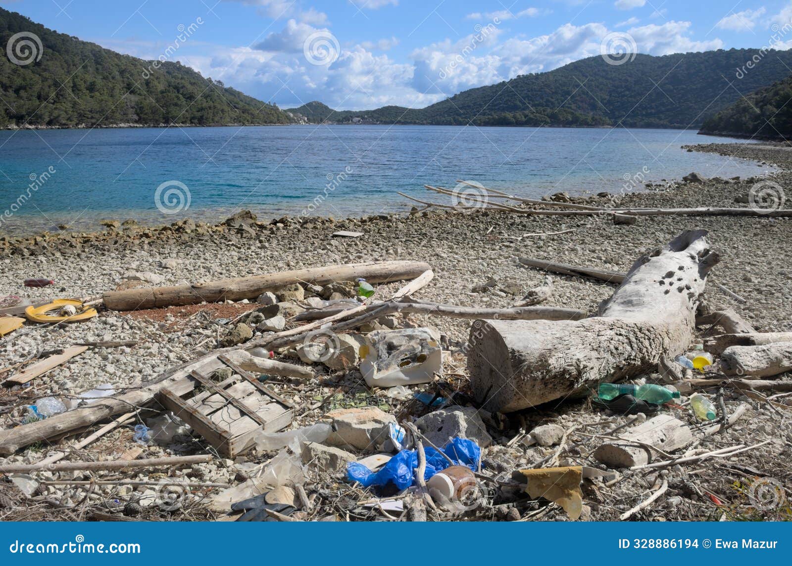 Trash the beach in Croatia stock photo. Image of bottle - 328886194