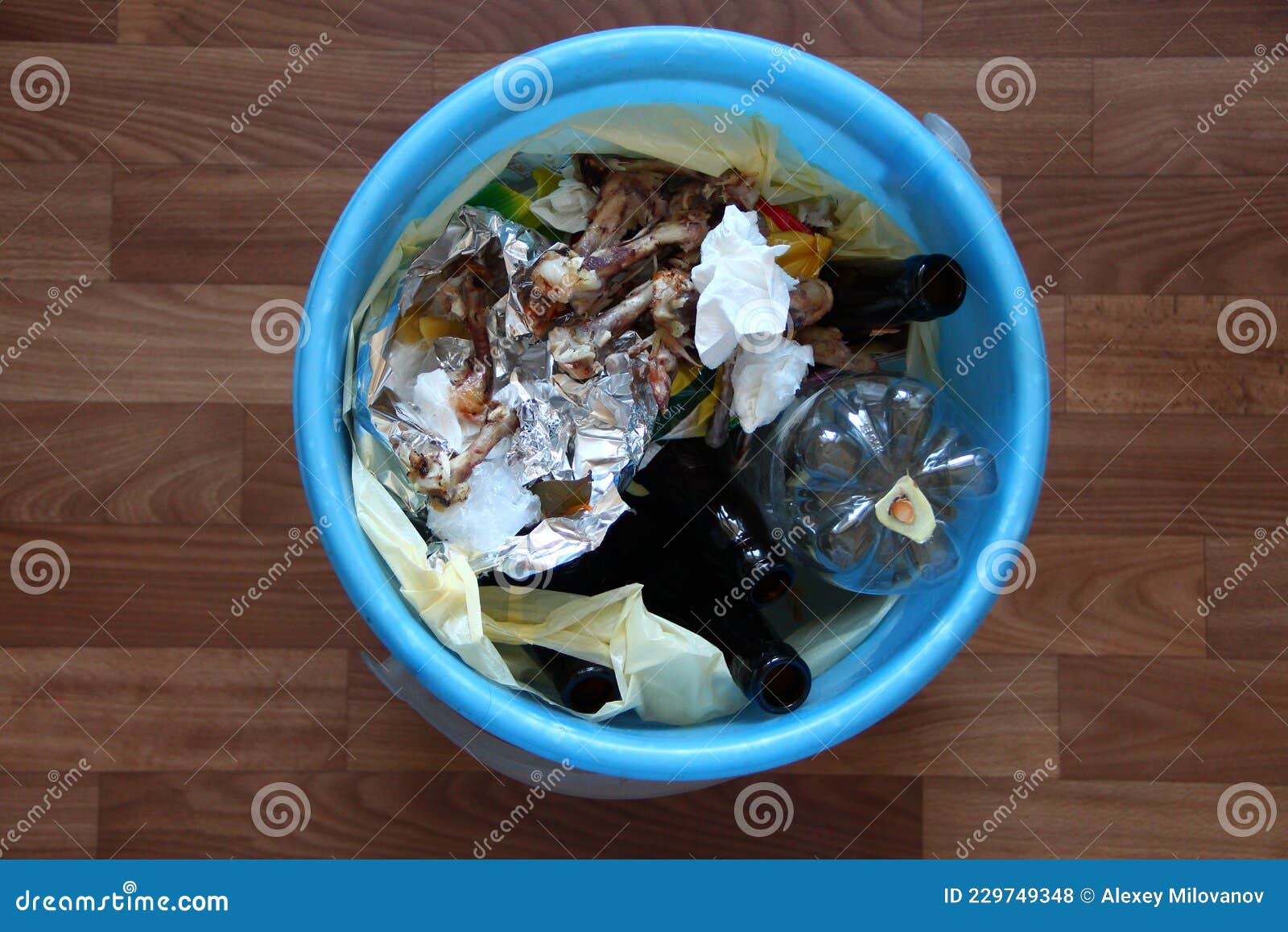 Trash Bin with Leftover Food and Chicken Bones, Top View Stock Photo ...