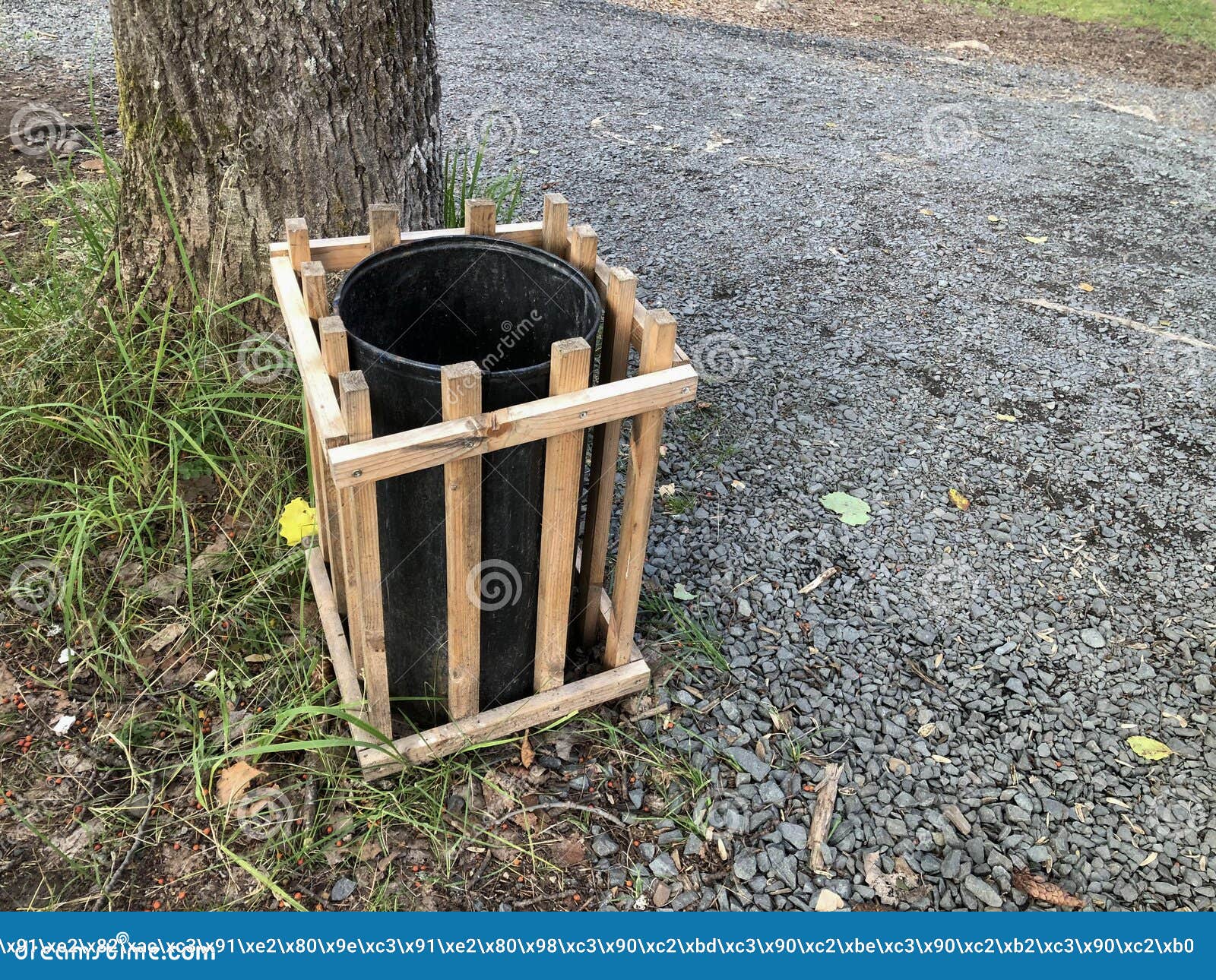 The Trash Bin is Trimmed with Wood Outside. Stock Photo - Image of ...