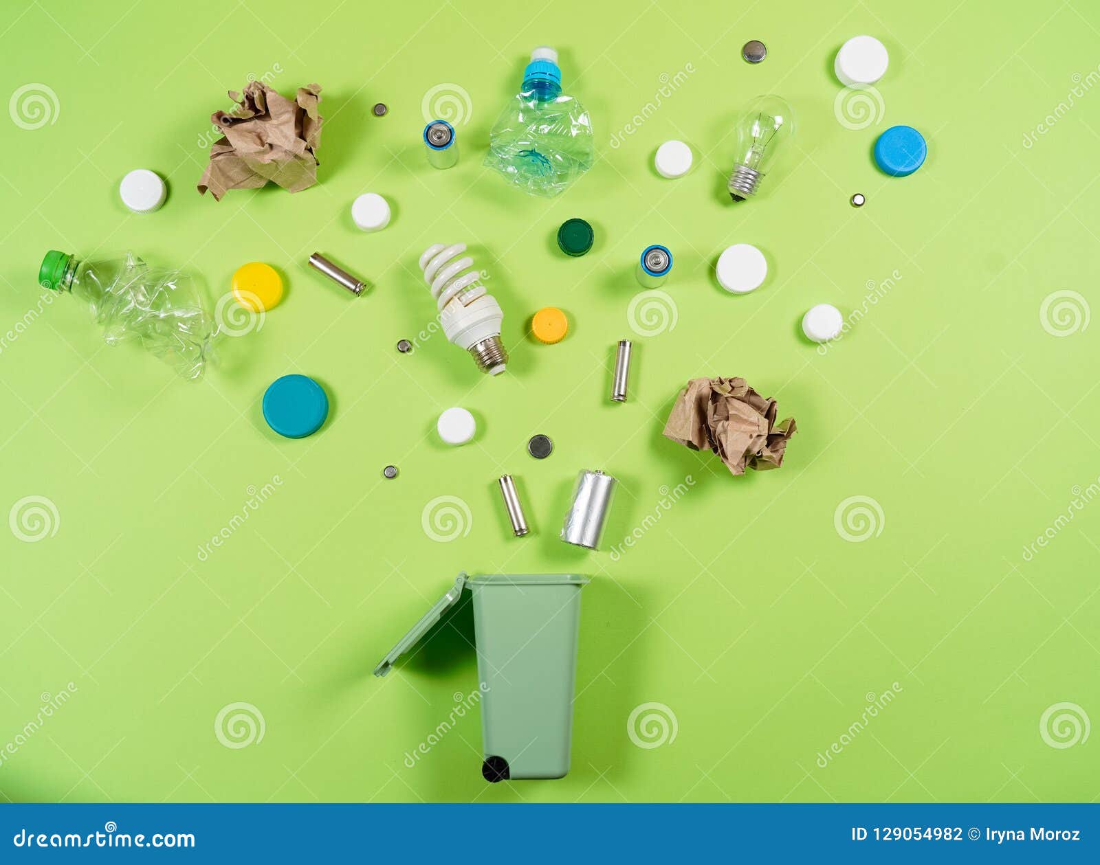 Trash Bins and Assorted Garbage Isolated on Green, Recycle Concept ...