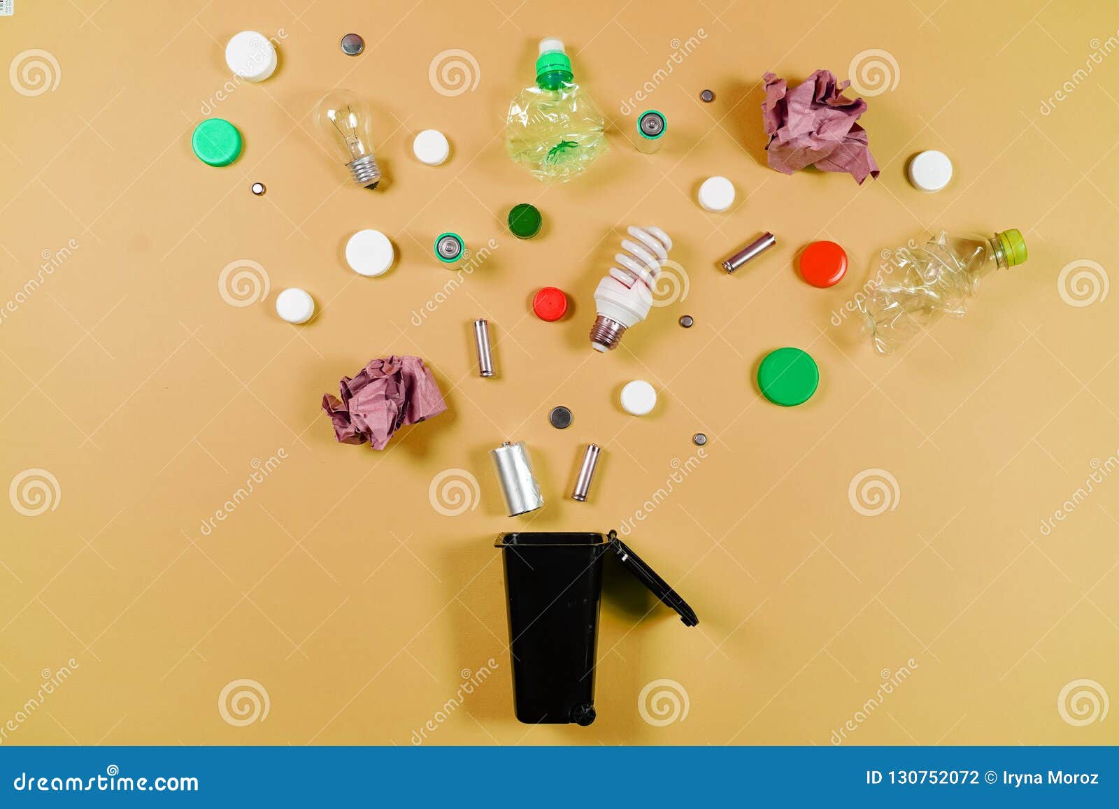 Trash Bins and Assorted Garbage Isolated on Green, Recycle Concept ...