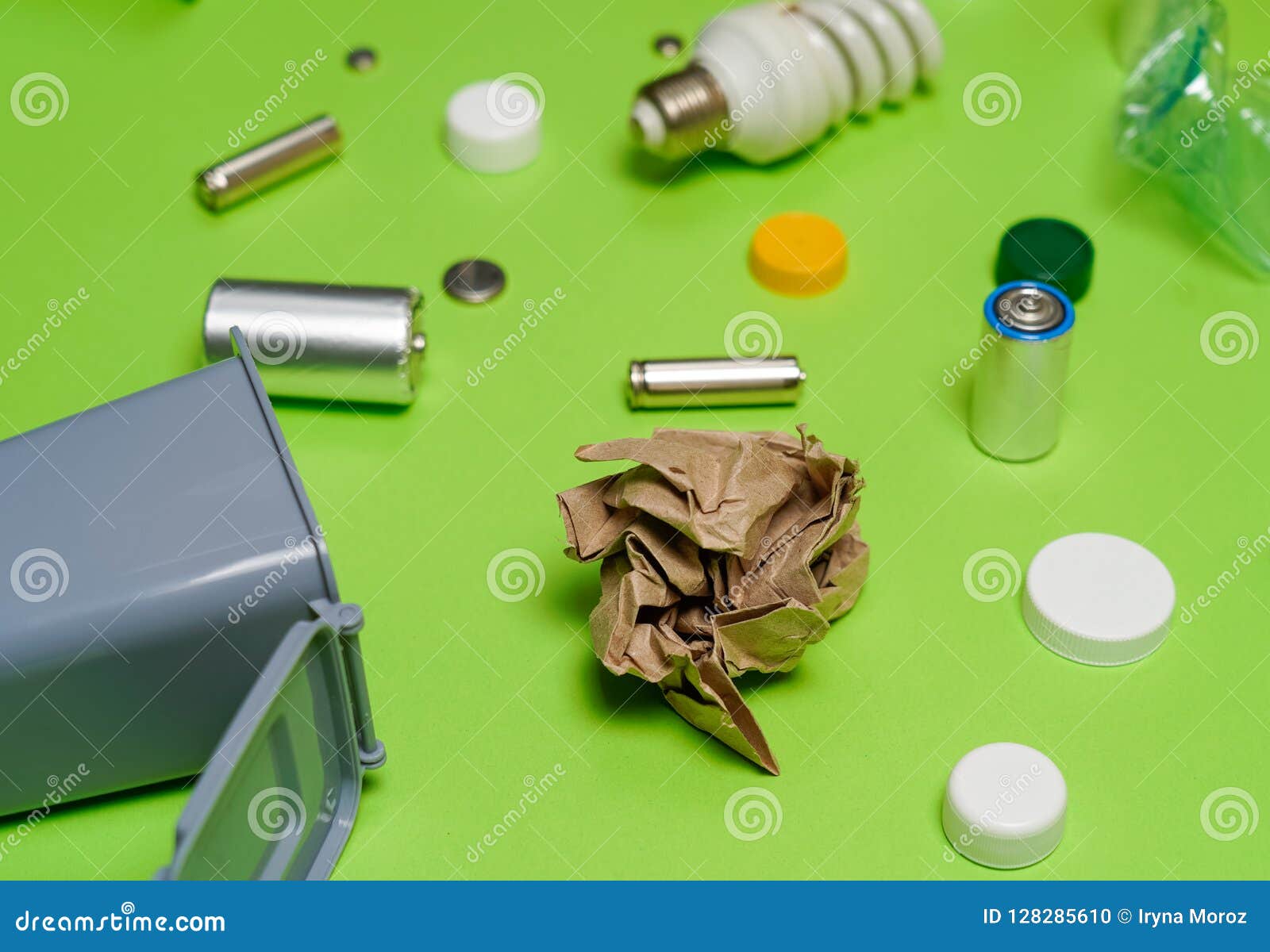 Trash Bins and Assorted Garbage Isolated on Green Stock Photo - Image ...