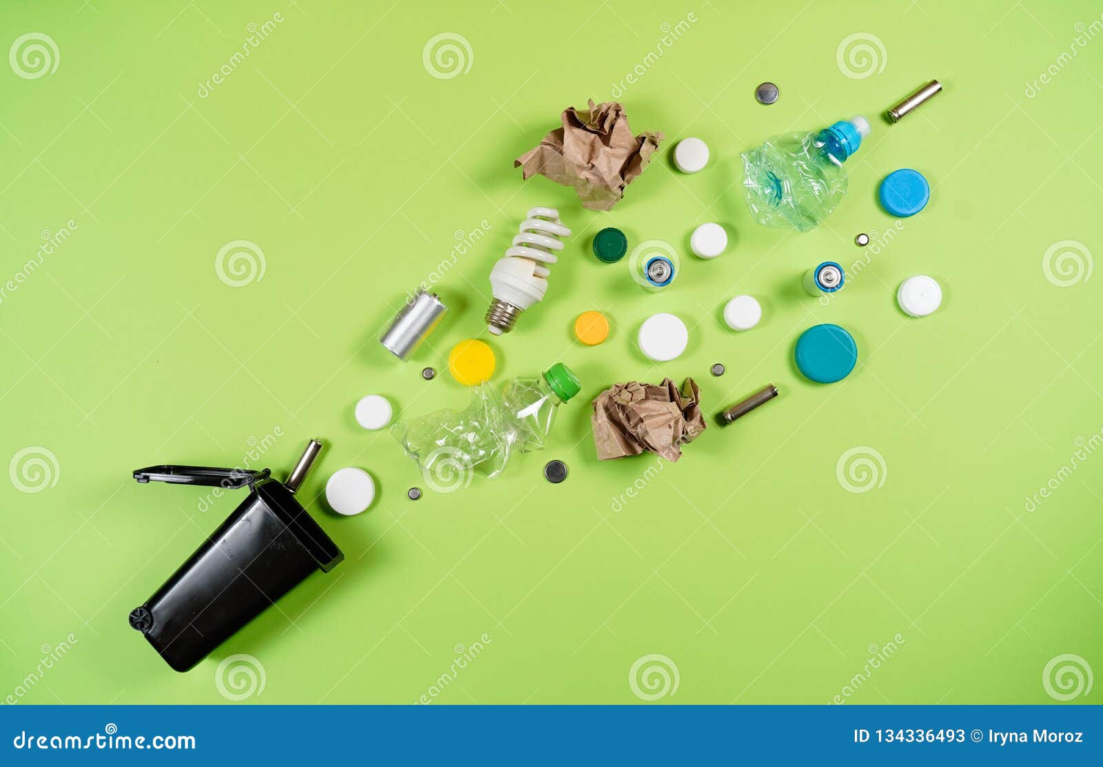 Trash Bins and Assorted Garbage Isolated on Green, Recycle Concept ...