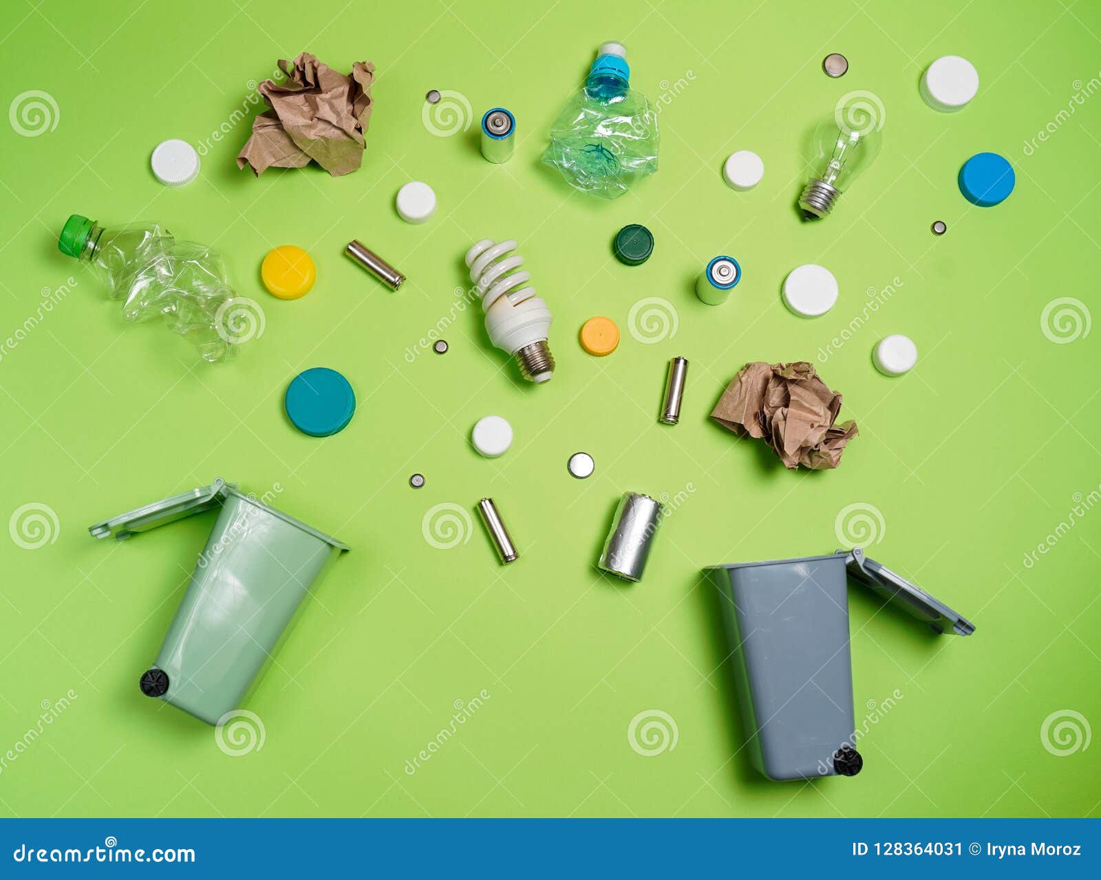 Trash Bins and Assorted Garbage Isolated on Green Stock Image - Image ...
