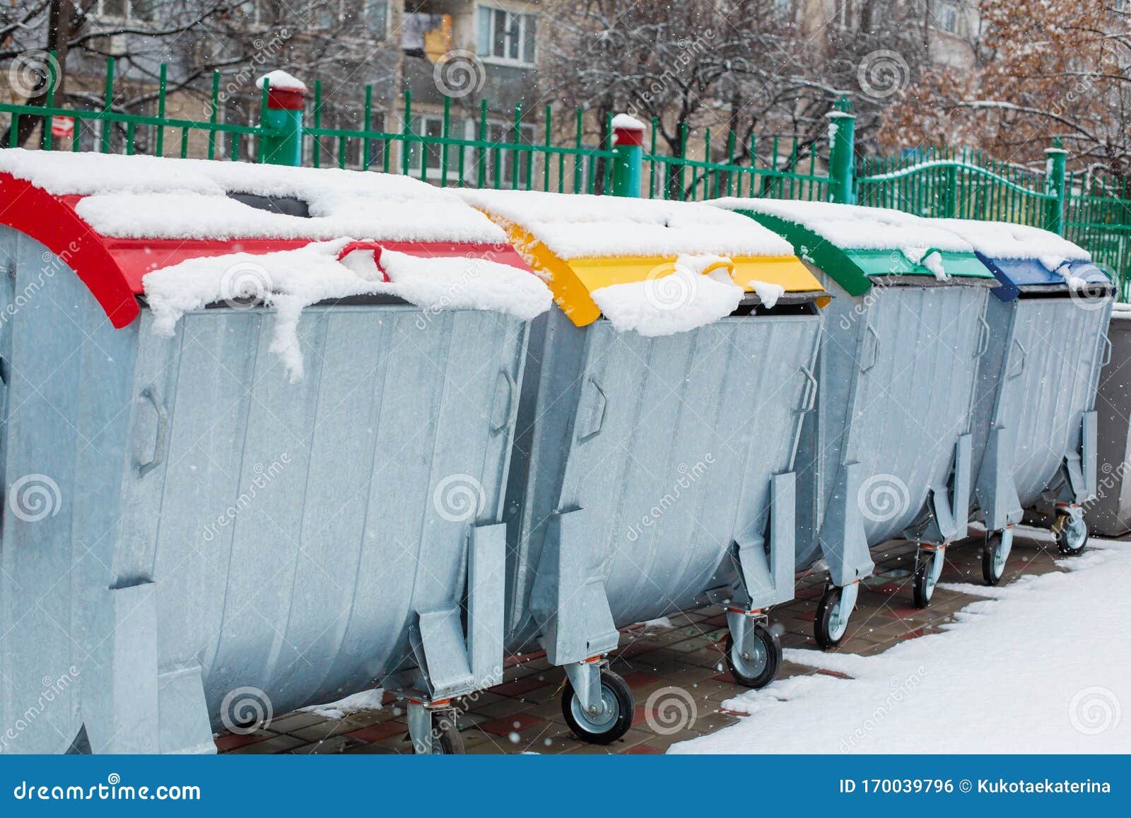 Trash Bins for Sorting Garbage are Standing on the Street Covered with ...