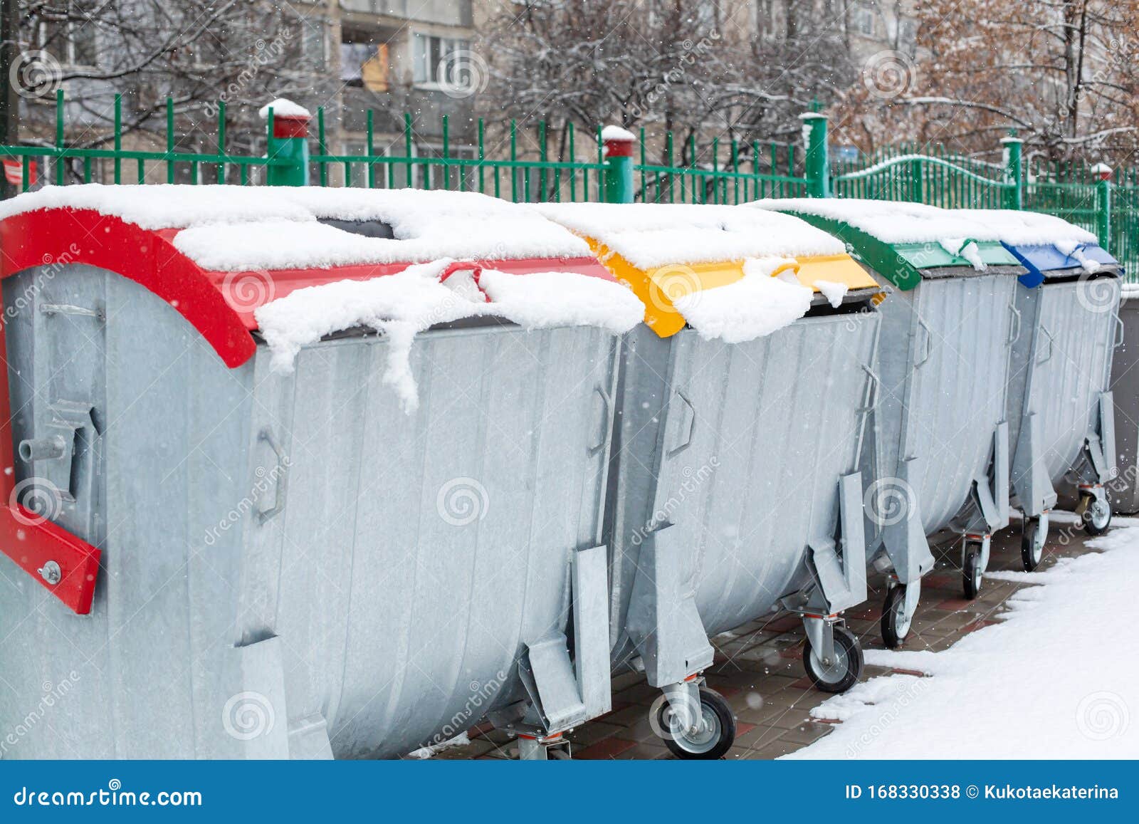 Trash Bins for Sorting Garbage are Standing on the Street Covered with ...