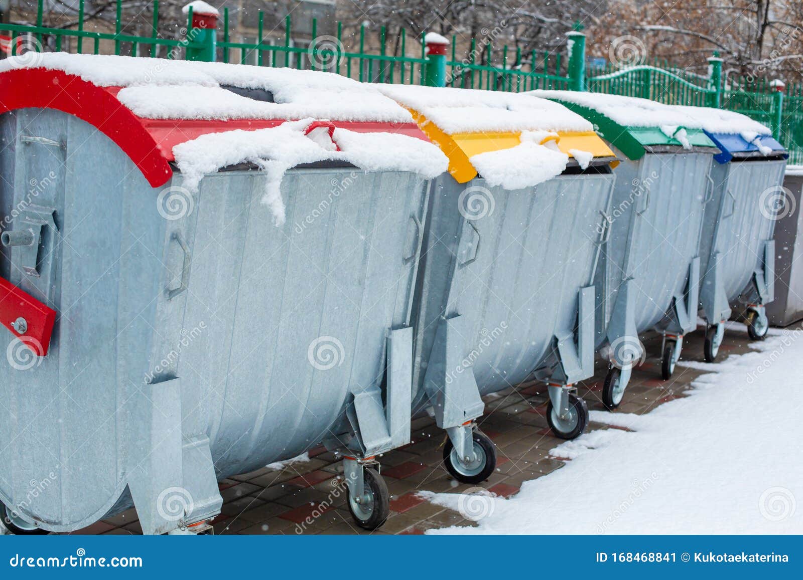 Trash Bins for Sorting Garbage are Standing on the Street Covered with ...