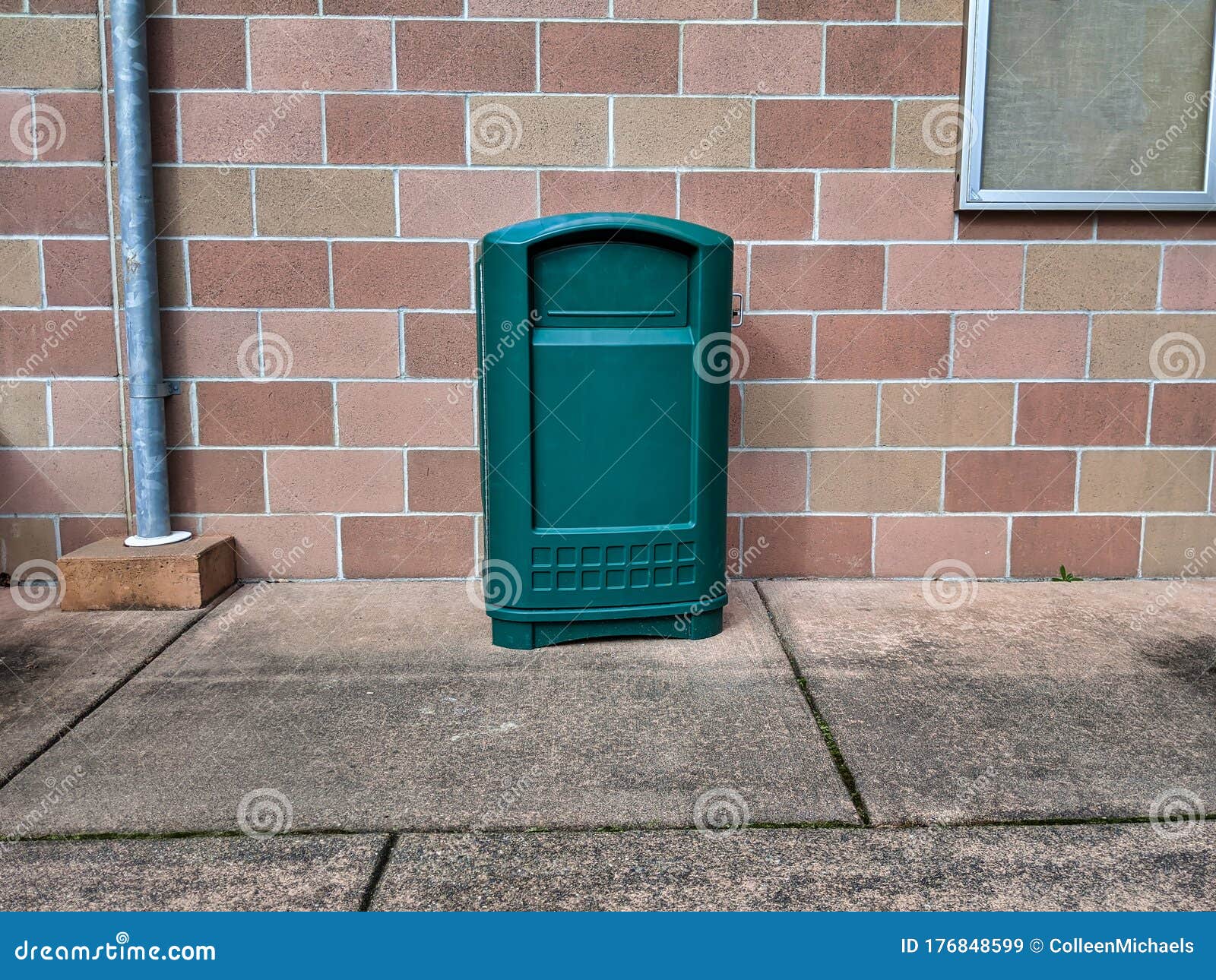 Trash Can Bin Against a Red Brick Wall Outdoors Stock Image - Image of ...