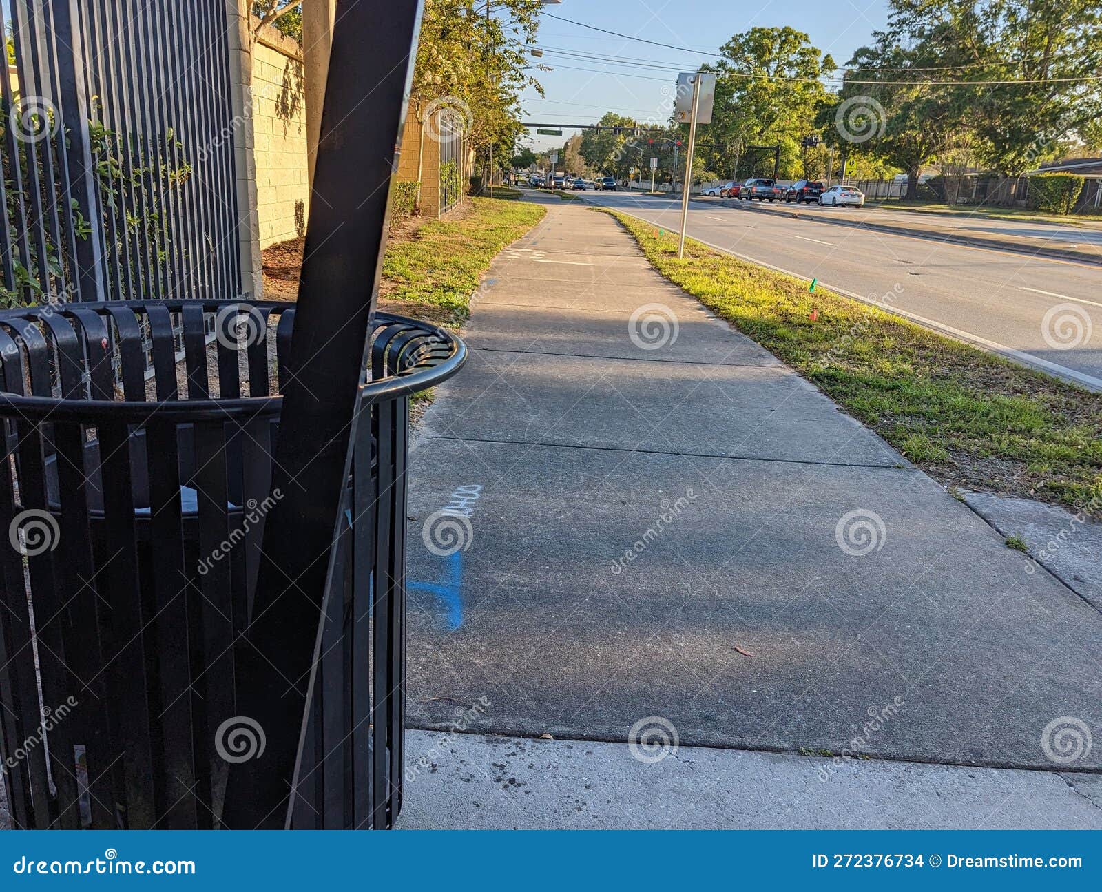 Trash Can at Bus Stop with Sidewalk Stock Photo - Image of downtown ...