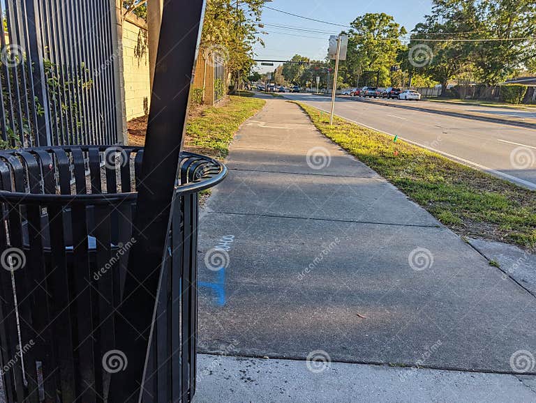 Trash Can at Bus Stop with Sidewalk Stock Photo - Image of downtown ...