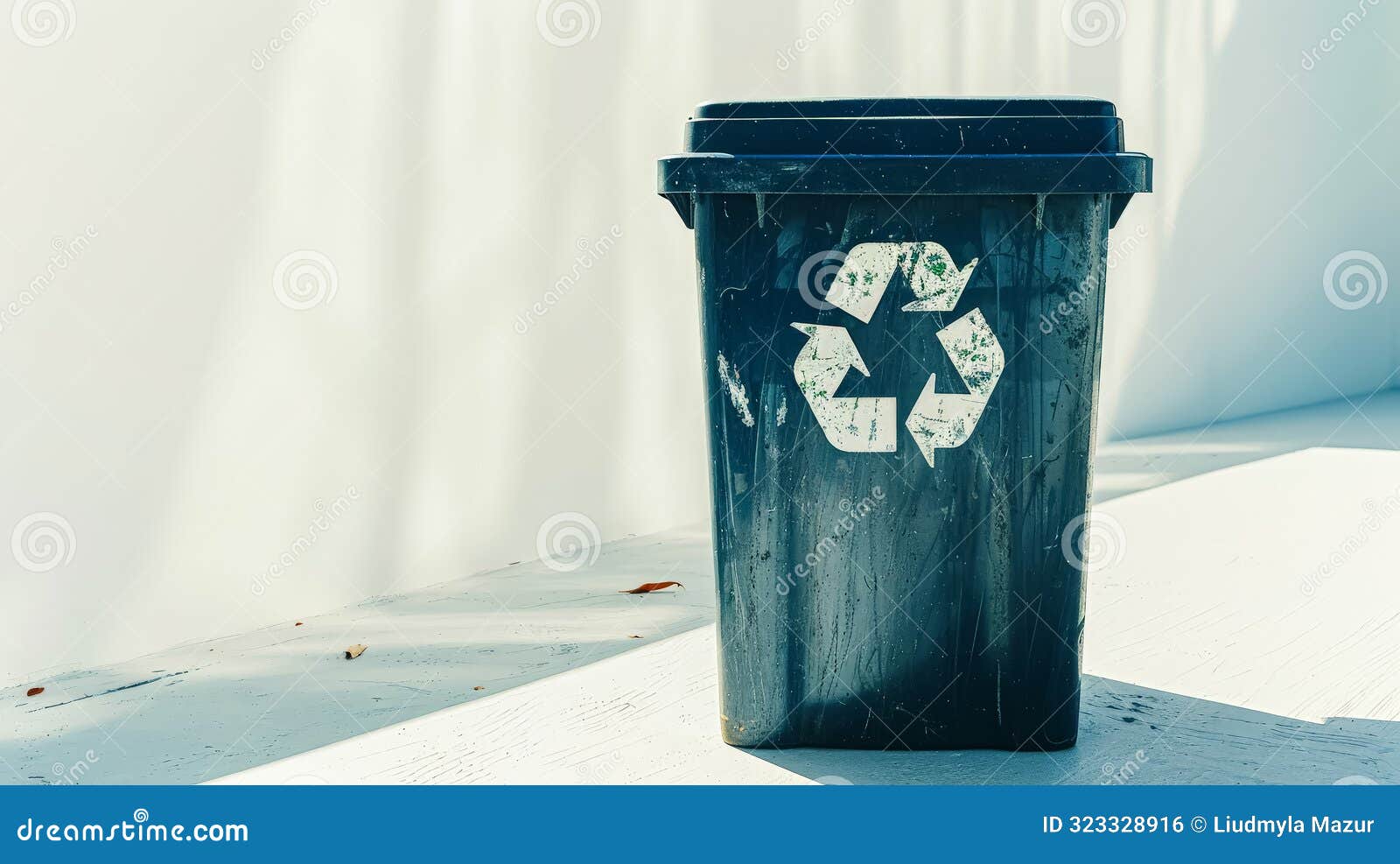 A Trash Can with a Green Recycling Symbol on it. Stock Photo - Image of ...