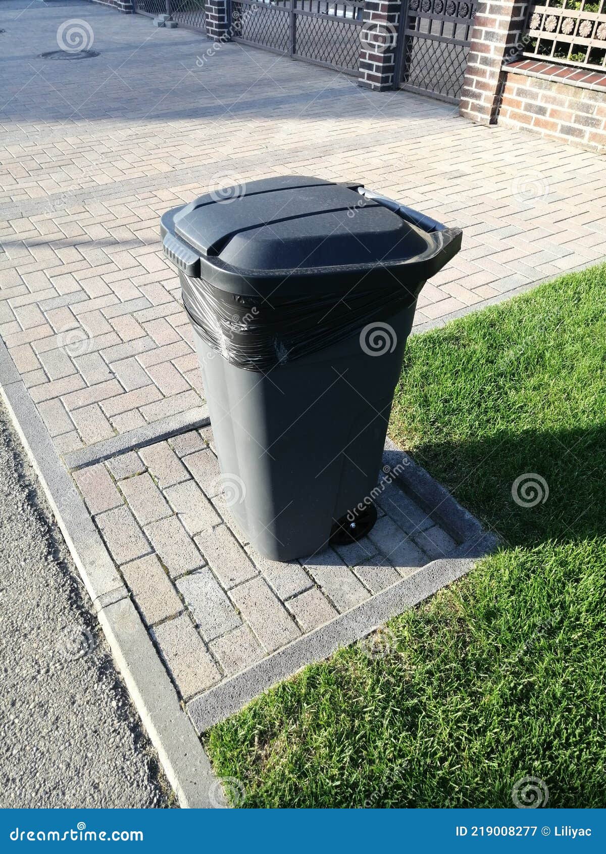 Trash can on the sidewalk stock image. Image of environment - 219008277