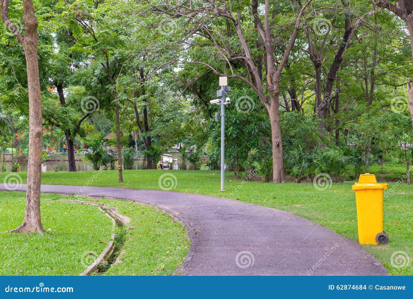 Trash Cans in the Park beside the Walk Way Stock Photo - Image of cans ...