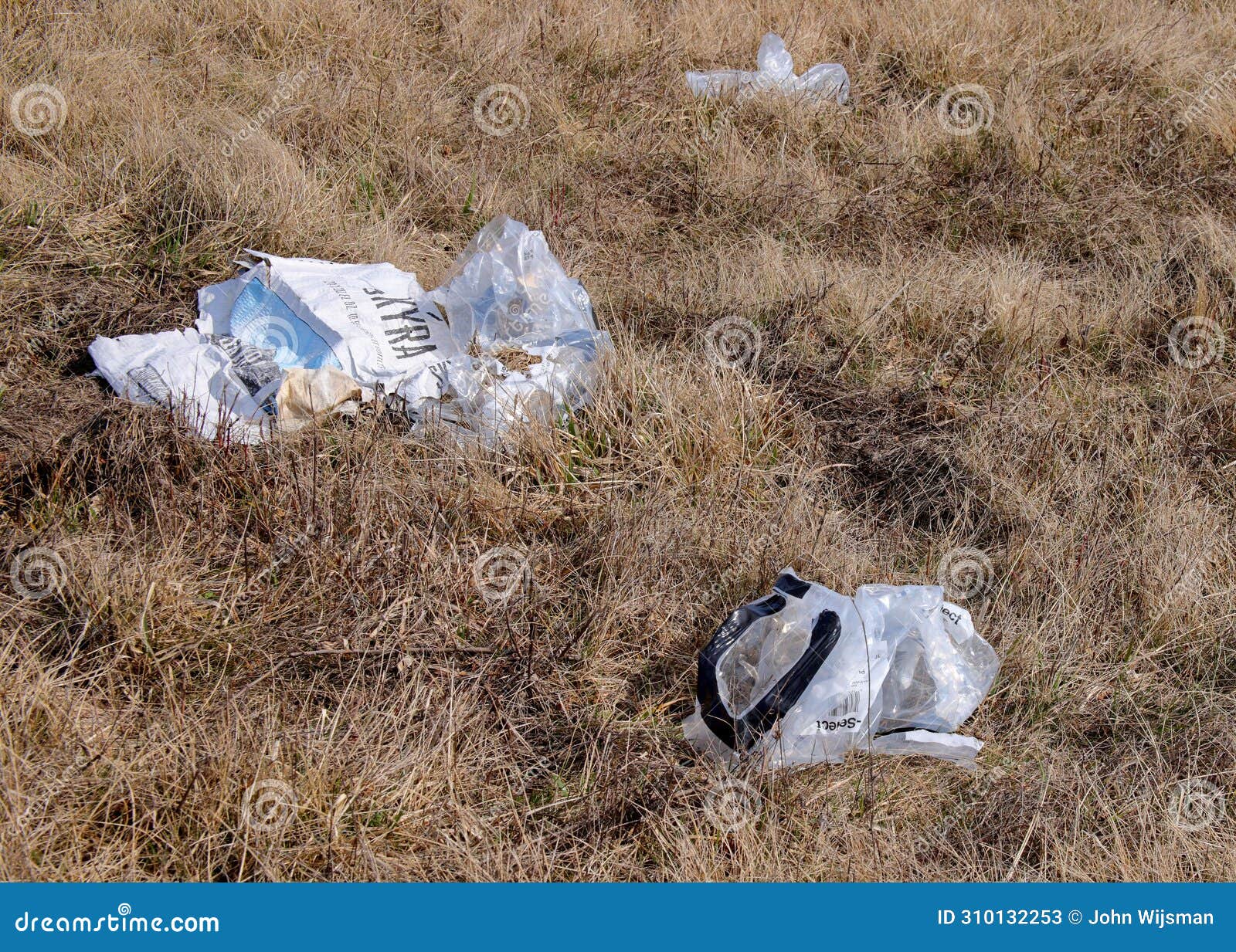 Trash dumped in a field editorial stock photo. Image of dumped - 310132253