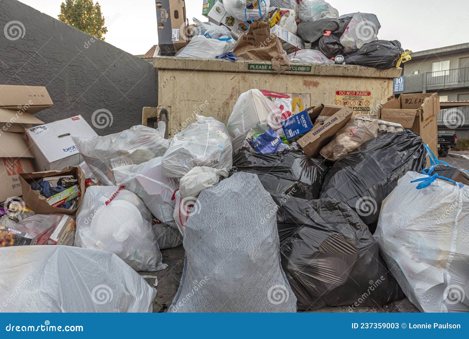 Trash Overflowing from a Dumpster Stock Image - Image of dumpster ...